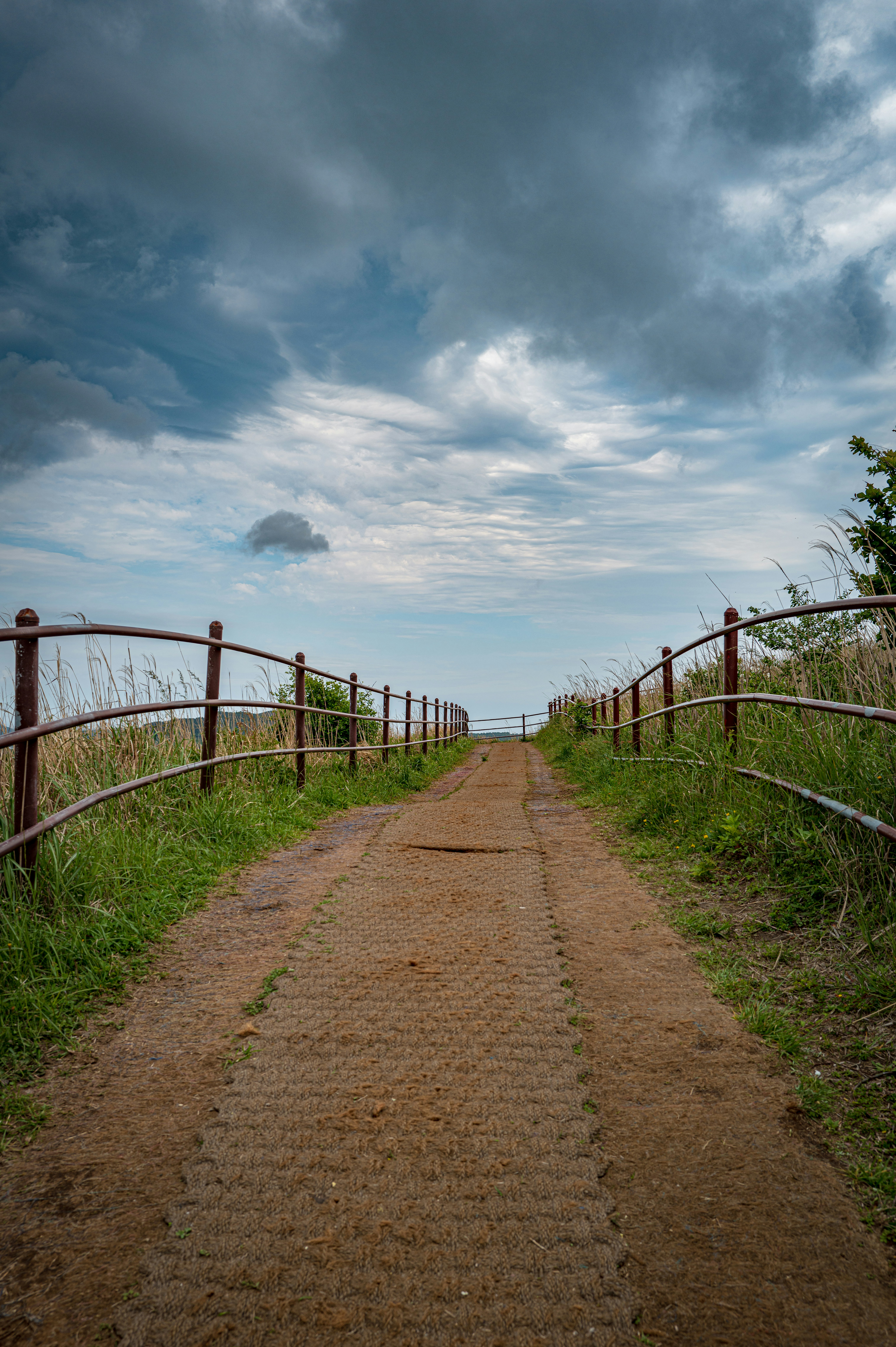 Path to the Open Sky: Rails Framing a Cloud-Scape