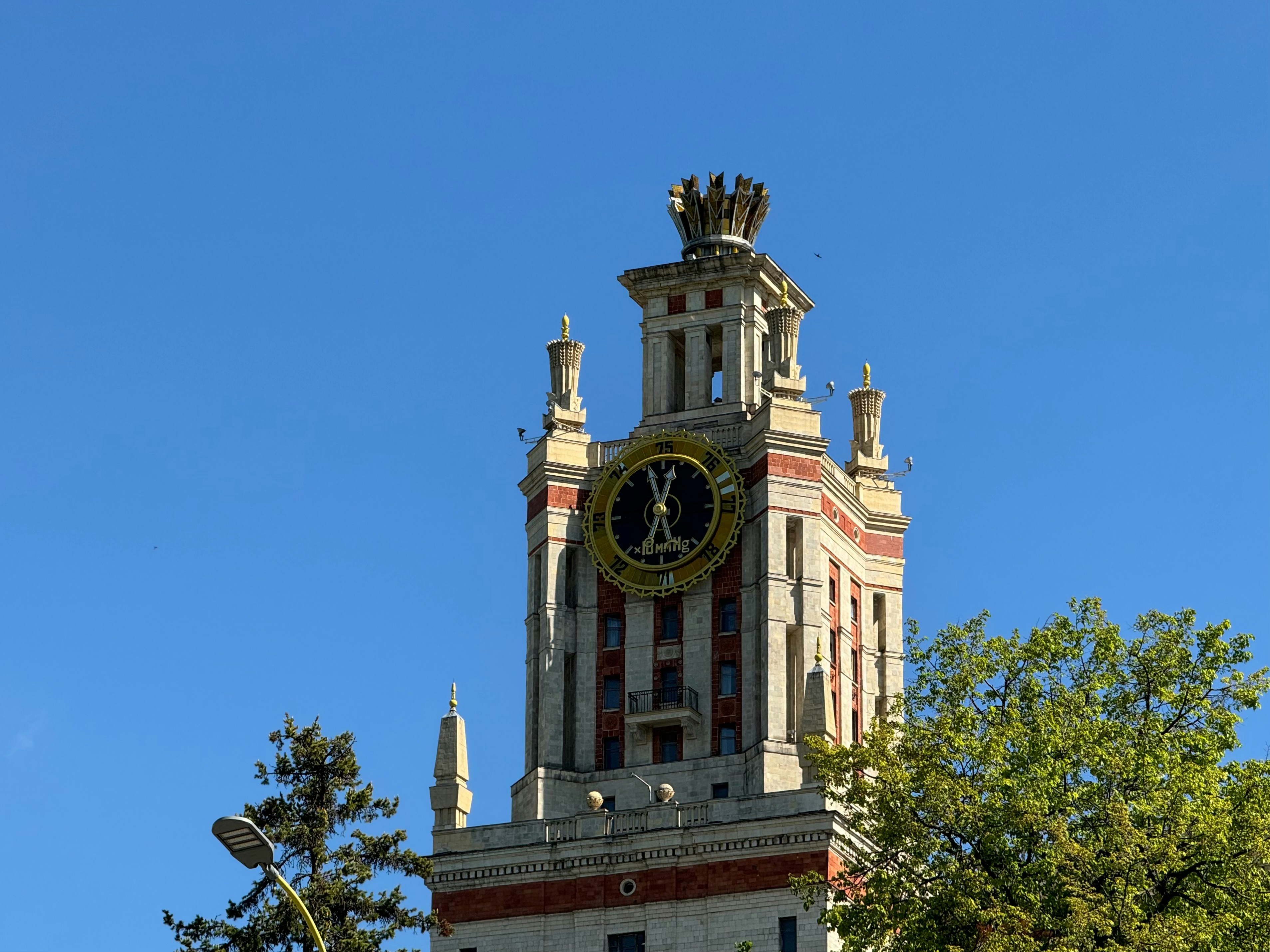 A tall clock tower with a clock on each of it's sides photo – Free ...