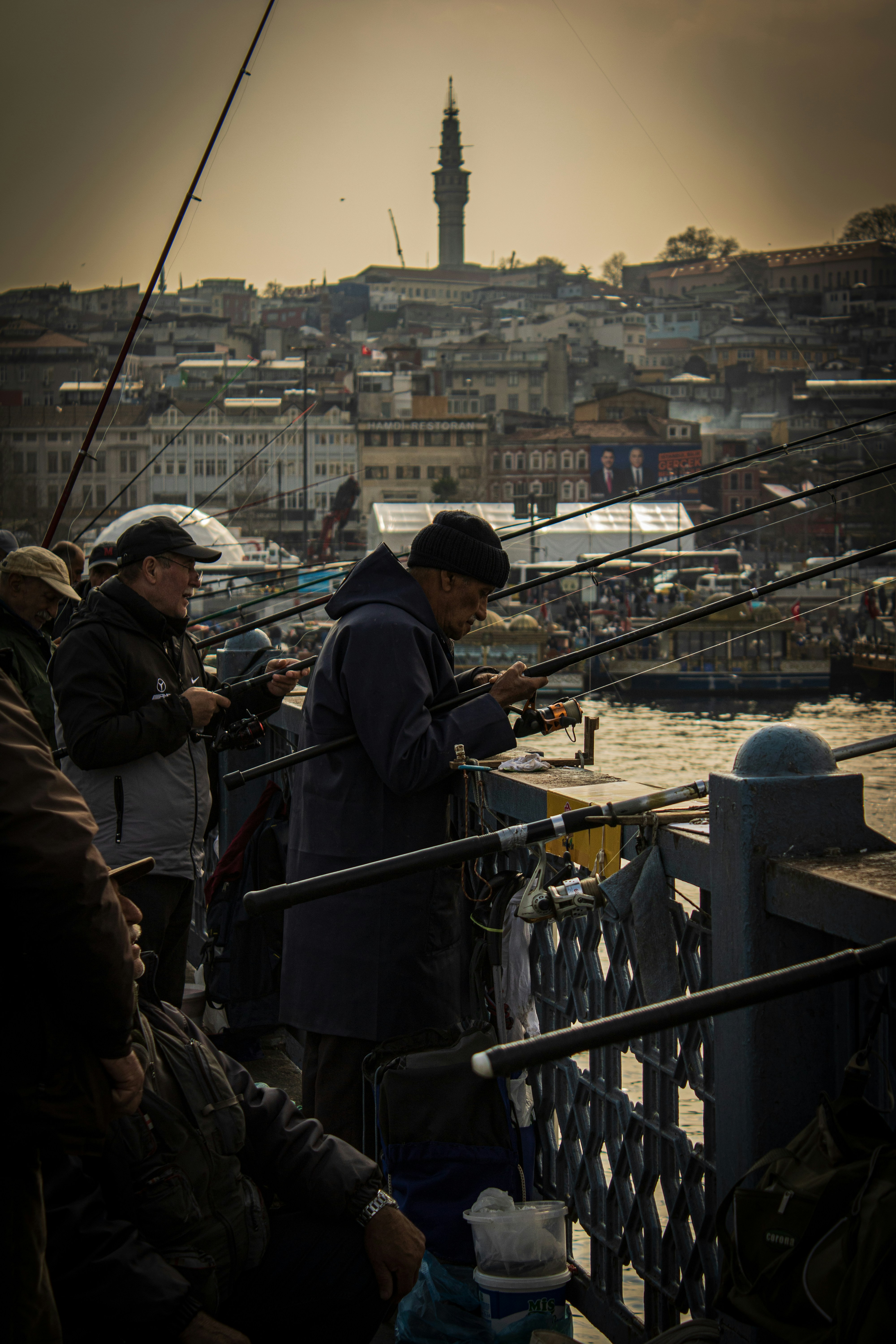 A group of people fishing on a pier photo – Free Fishman Image on Unsplash