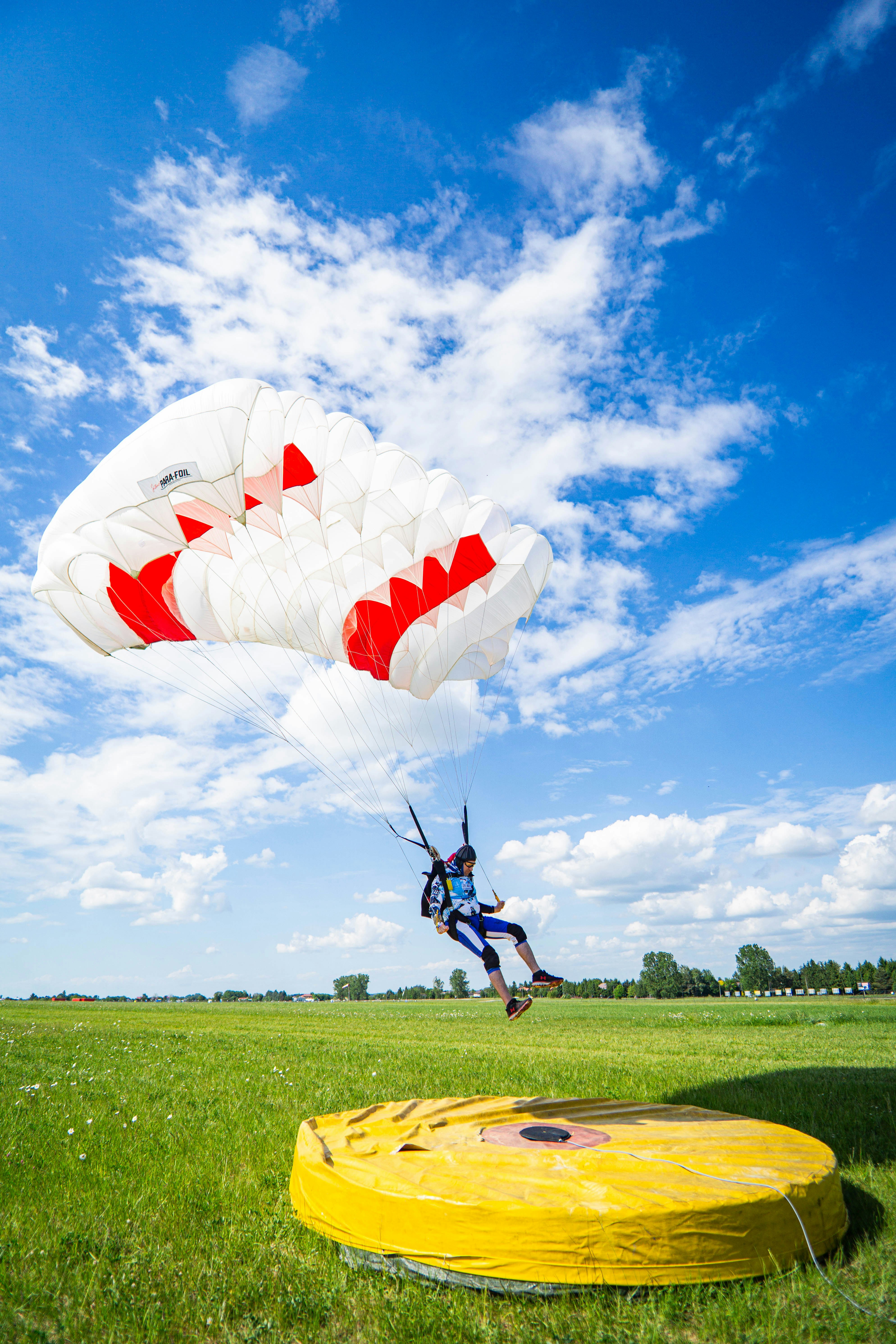 A person in the air with a parachute photo – Free Parachute Image on ...