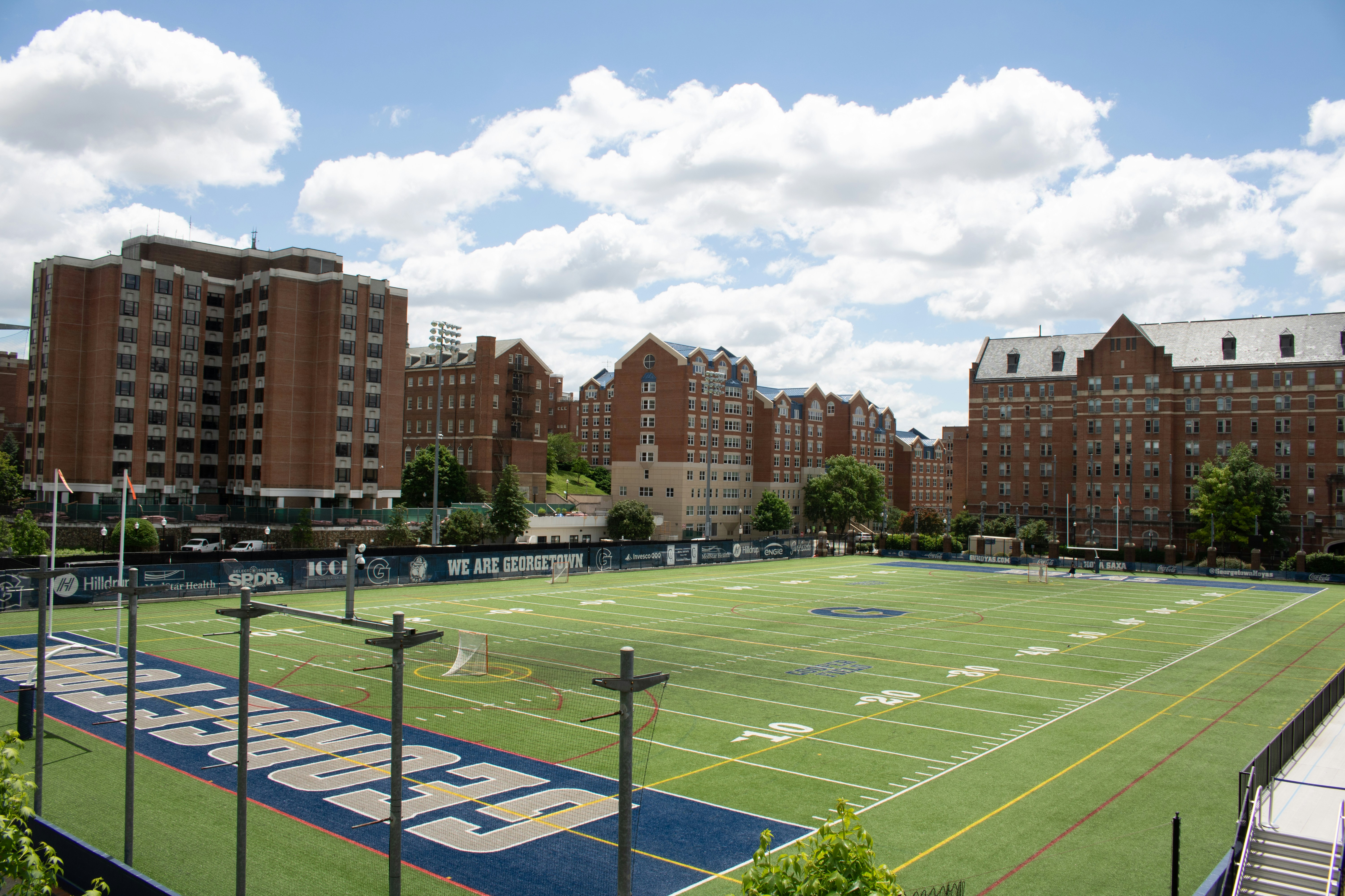 A view of a football field in a city photo – Free Georgetown university ...