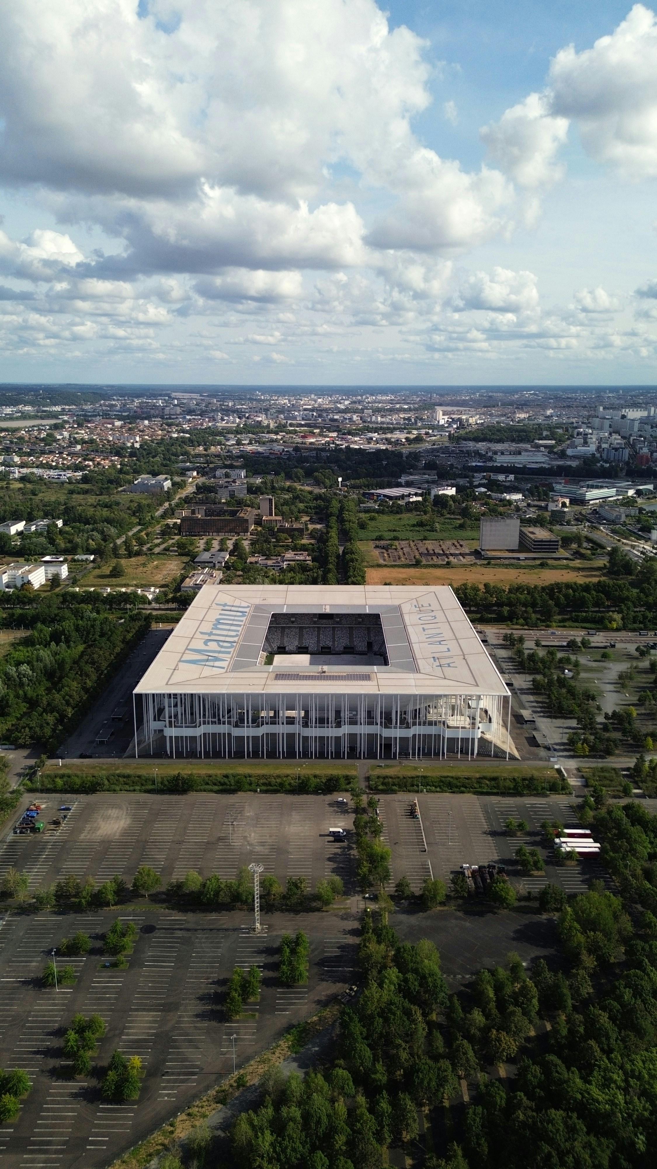 Open-Courtyard Monolith: Aerial Portrait of a Modern White Atrium