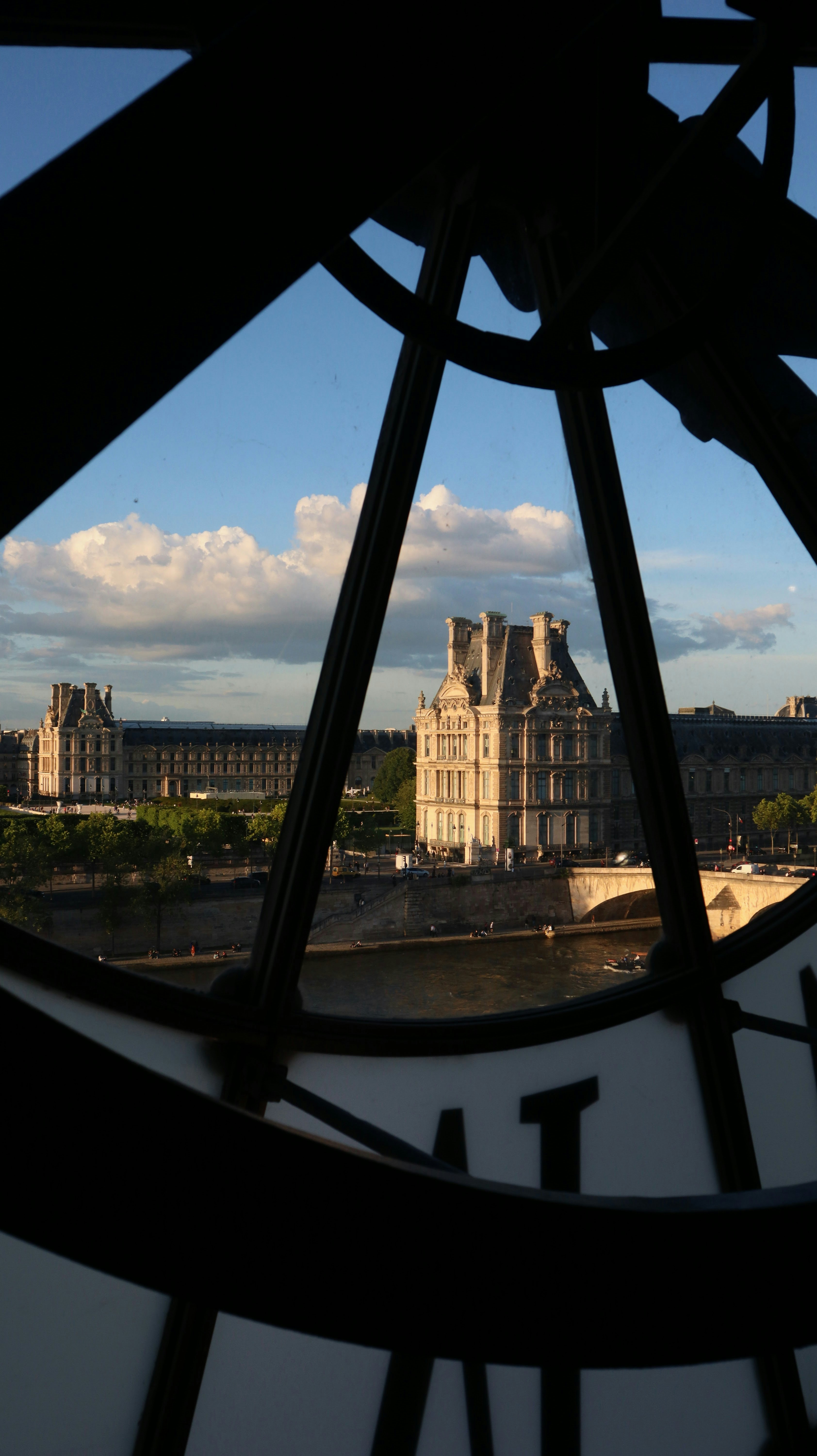 Moonlit Gears over the Louvre: A Clock’s View of Historic Facades