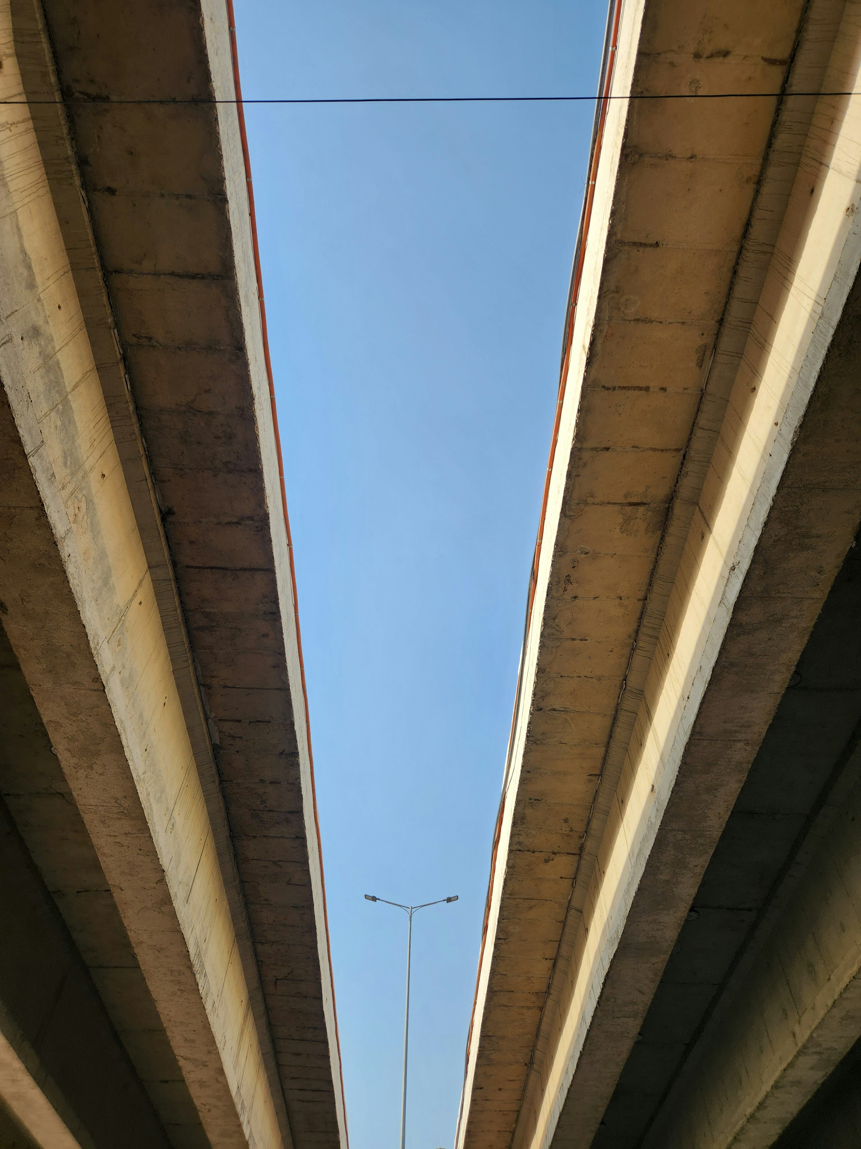 A view of the underside of a bridge from below photo – Free Road Image ...