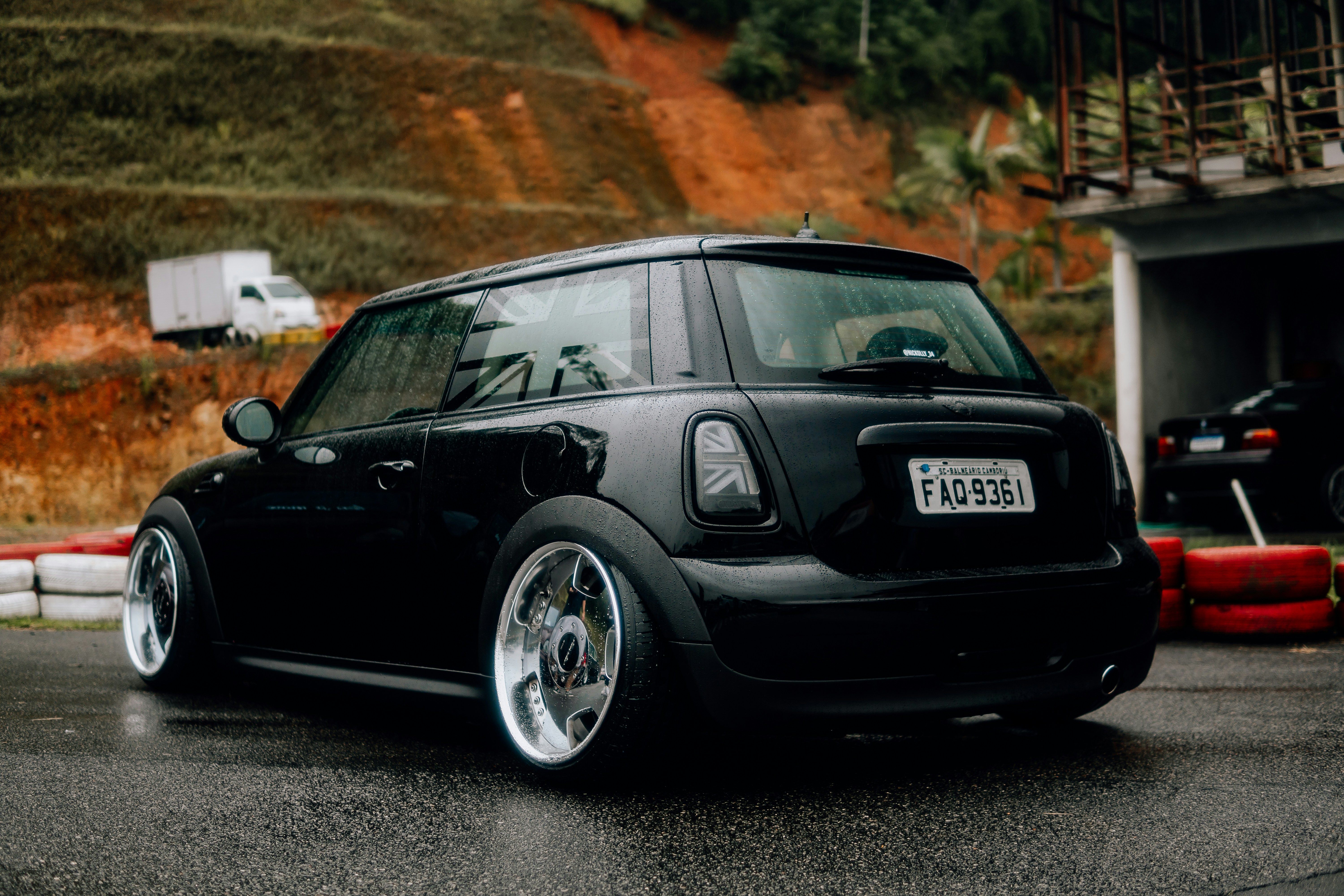 A small black car parked in a parking lot photo – Free Brasil Image on ...