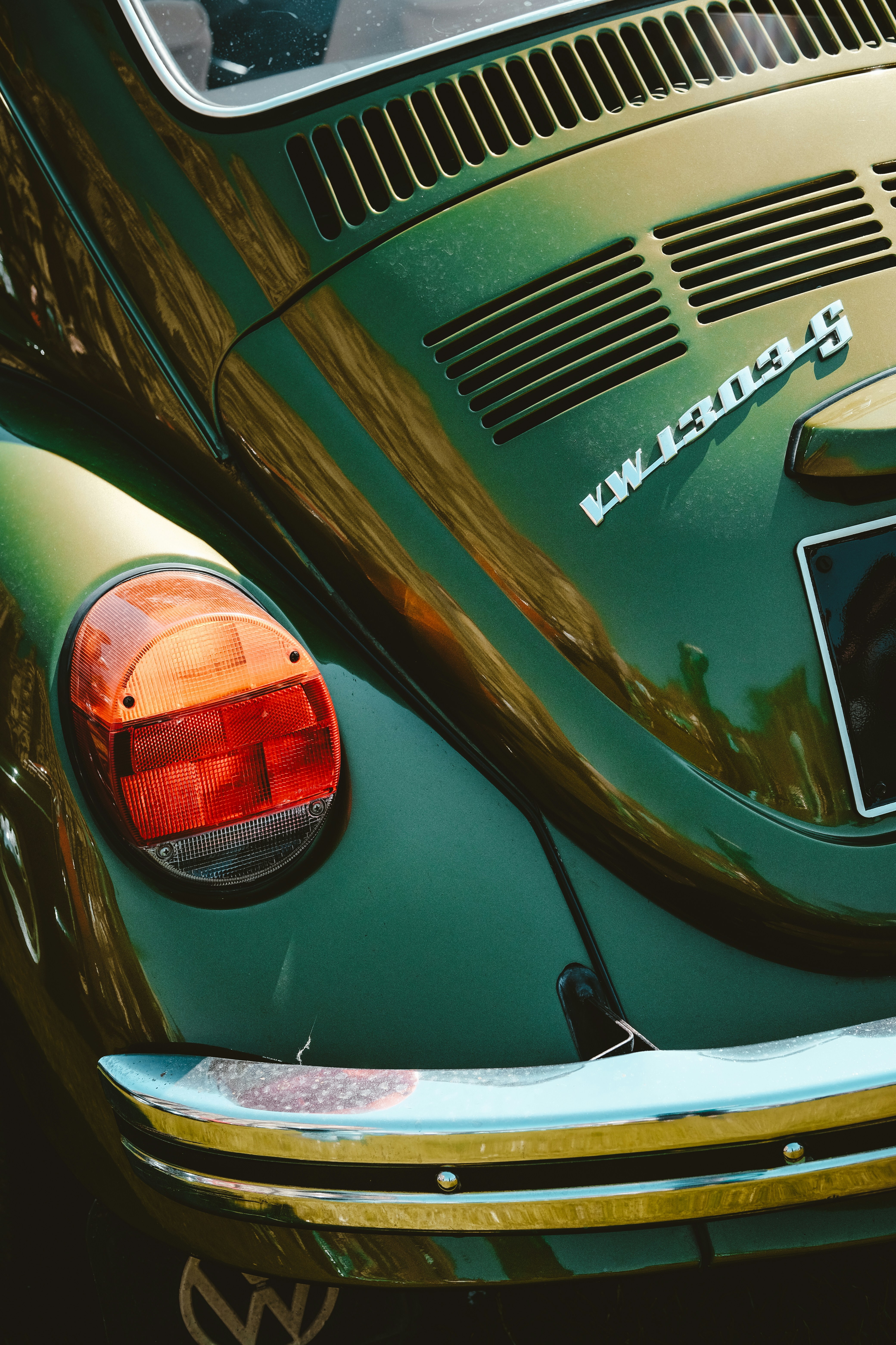 A close up of the tail lights of a green vw bug photo – Free Vintage ...