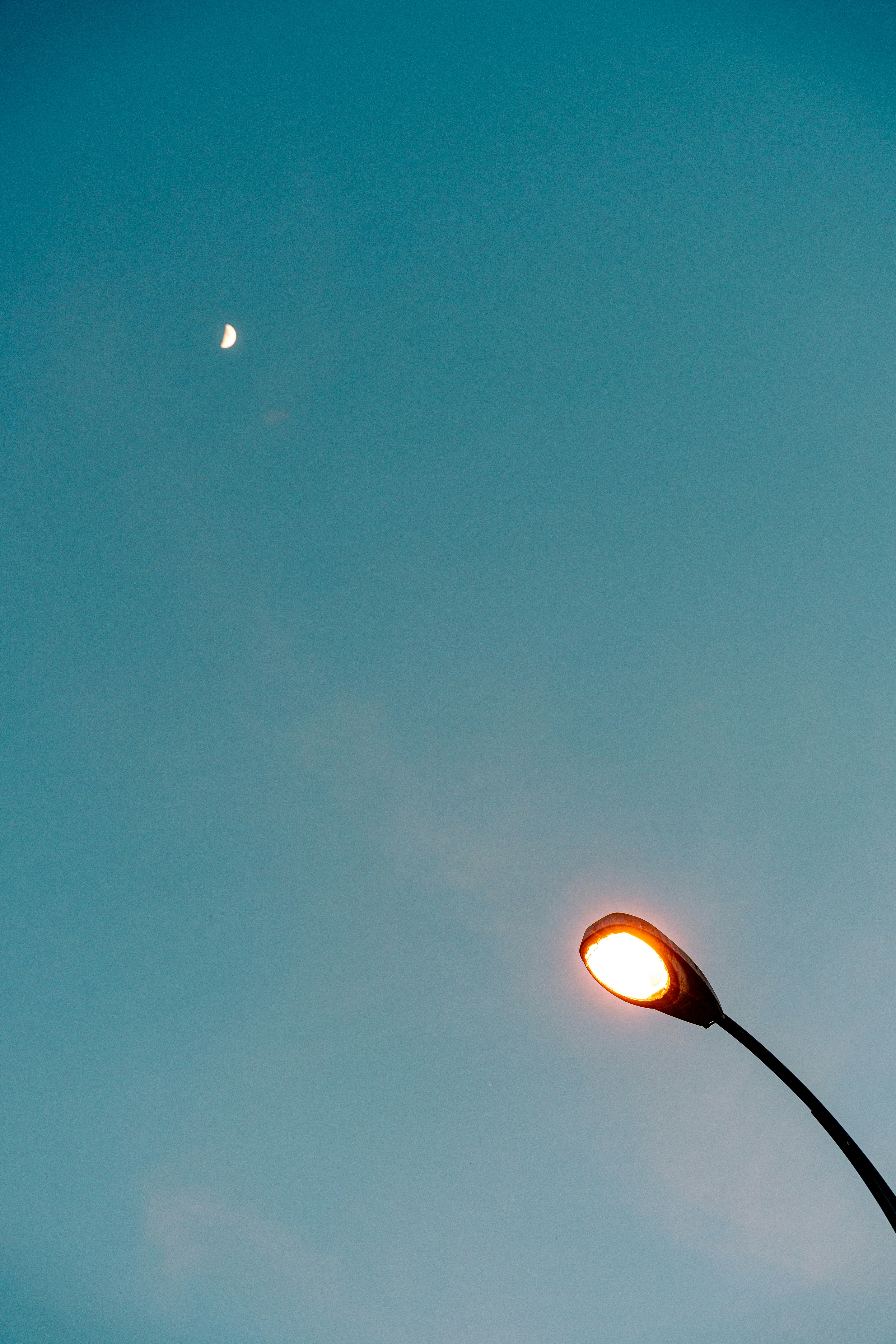 Evening Glow: A Street Lamp Against a Quiet Sky