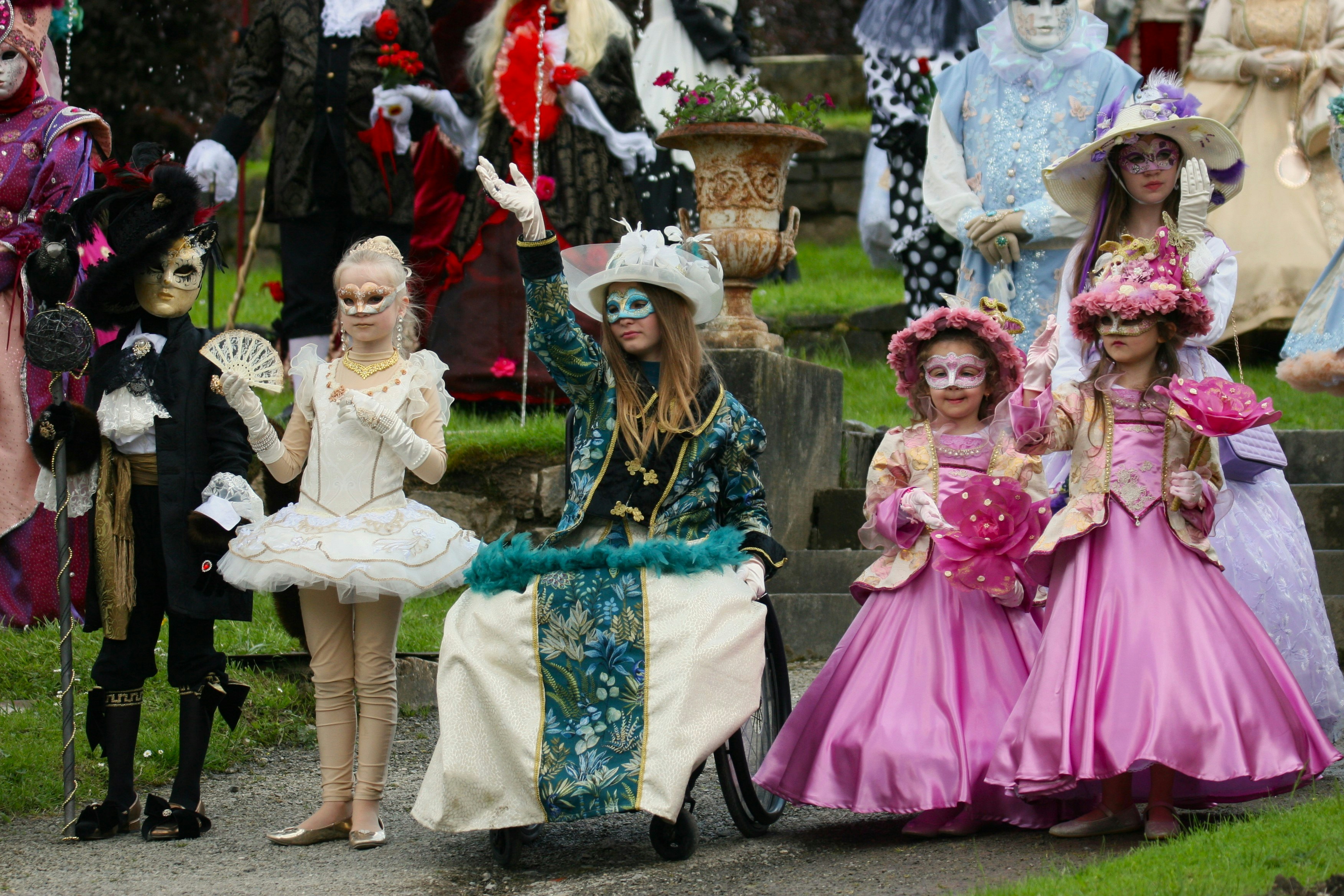 A group of people dressed up in costumes photo – Free Les jardins d ...