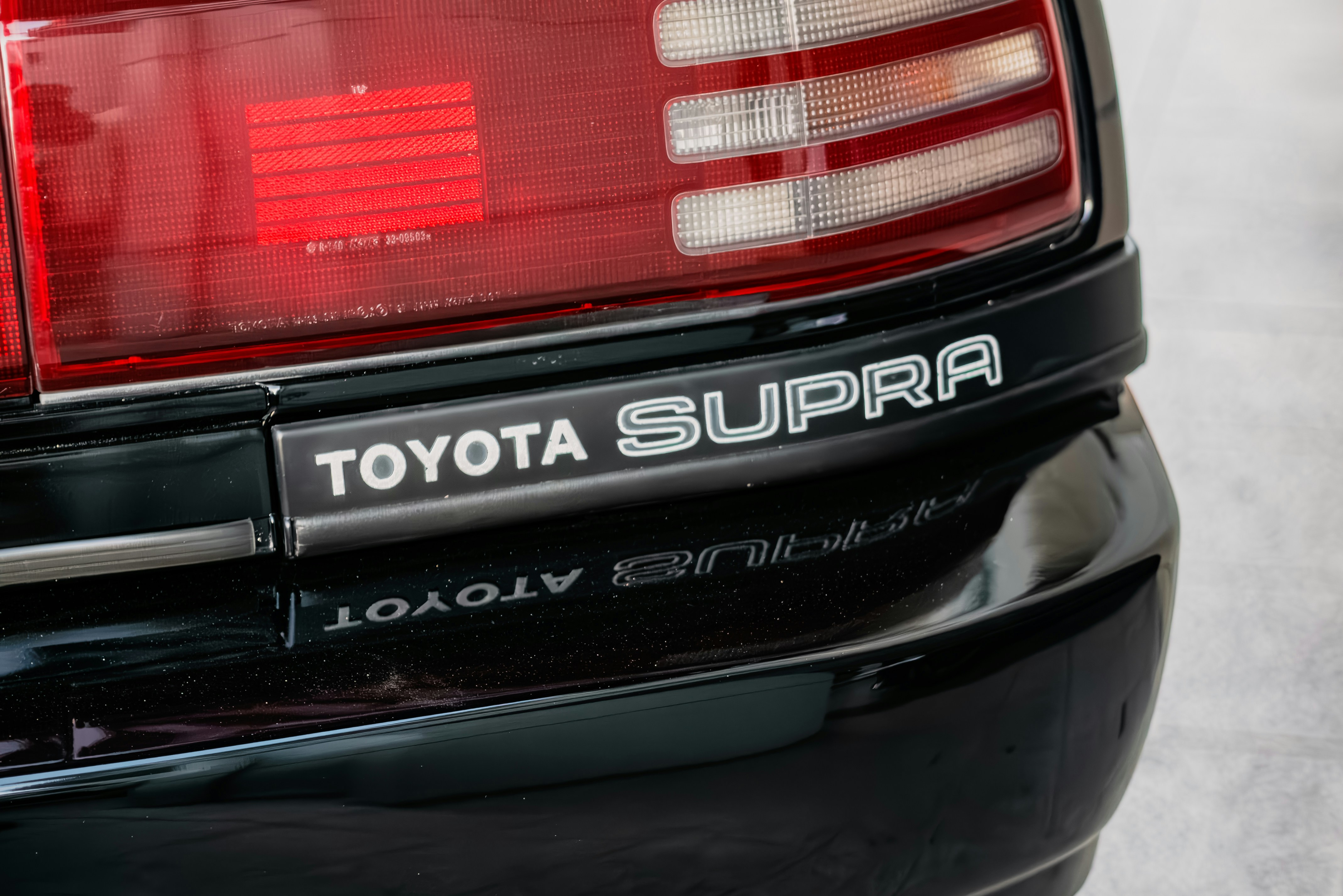 The rear end of a black toyota supra photo – Free Car Image on Unsplash