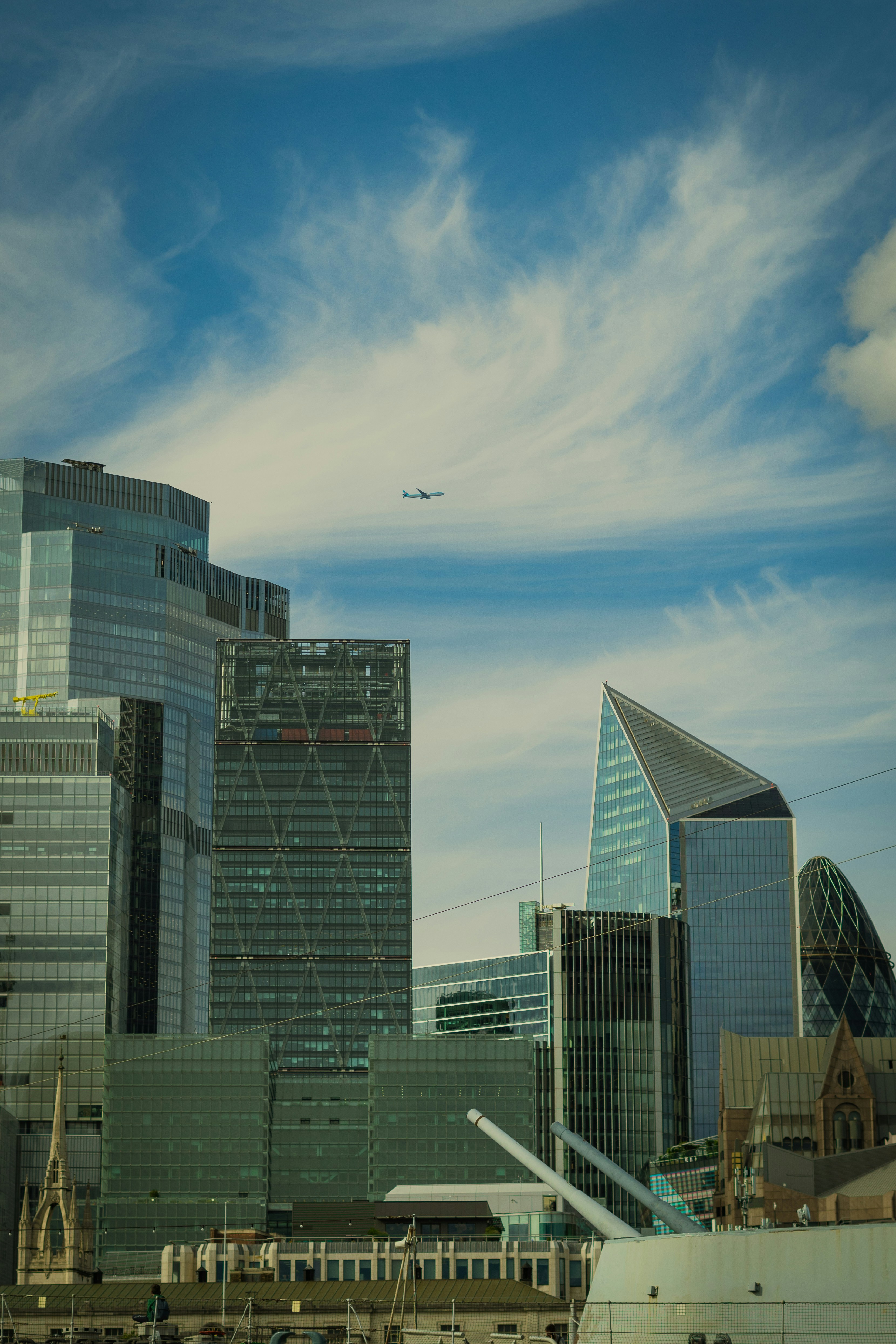Jet Above the Glass Curtain: Downtown Skyline in Daylight
