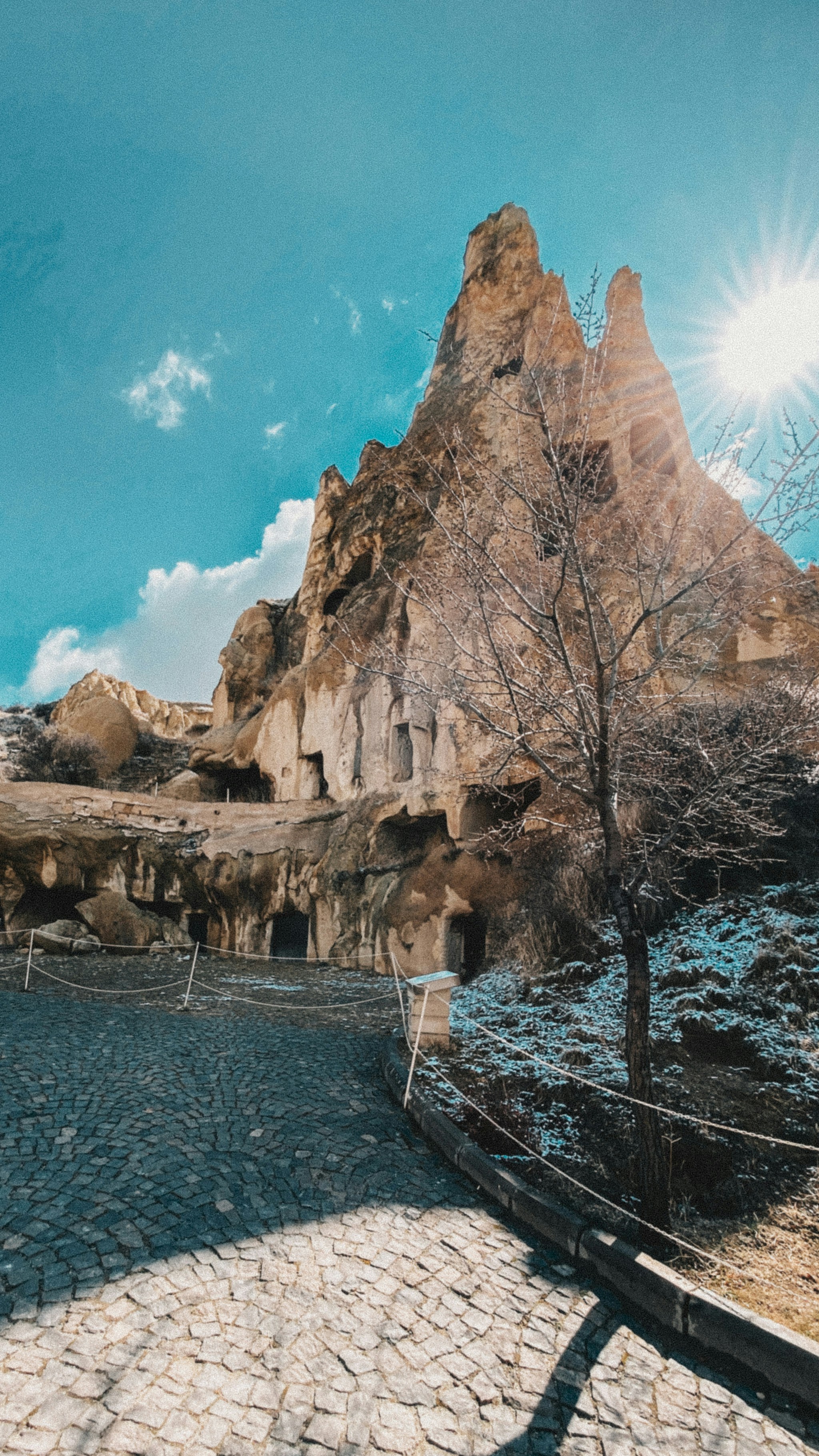 Cobbled Way to a Sunlit Cliff Fortress