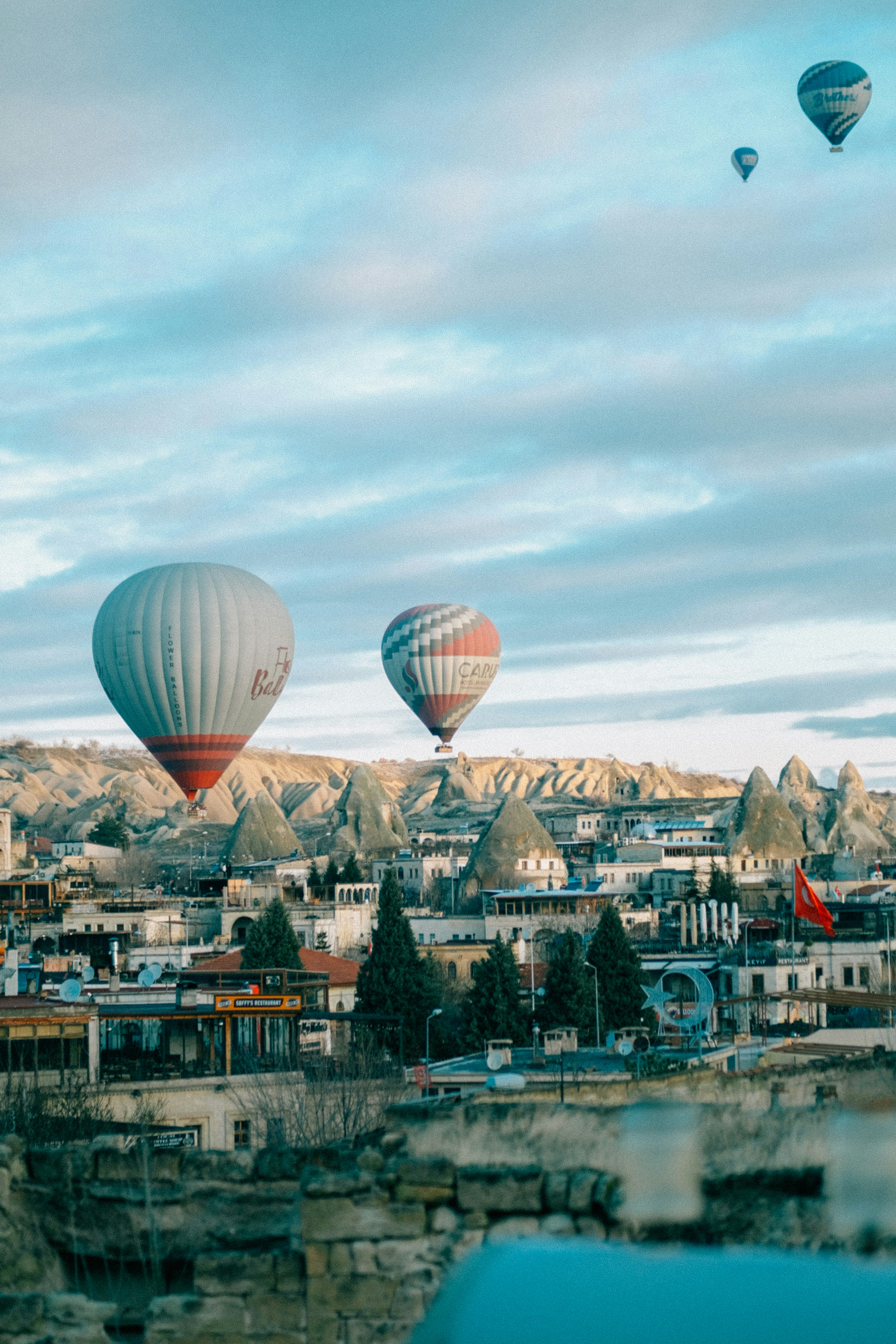 Balloon Parade Over Cappadocia's Stone Skyline