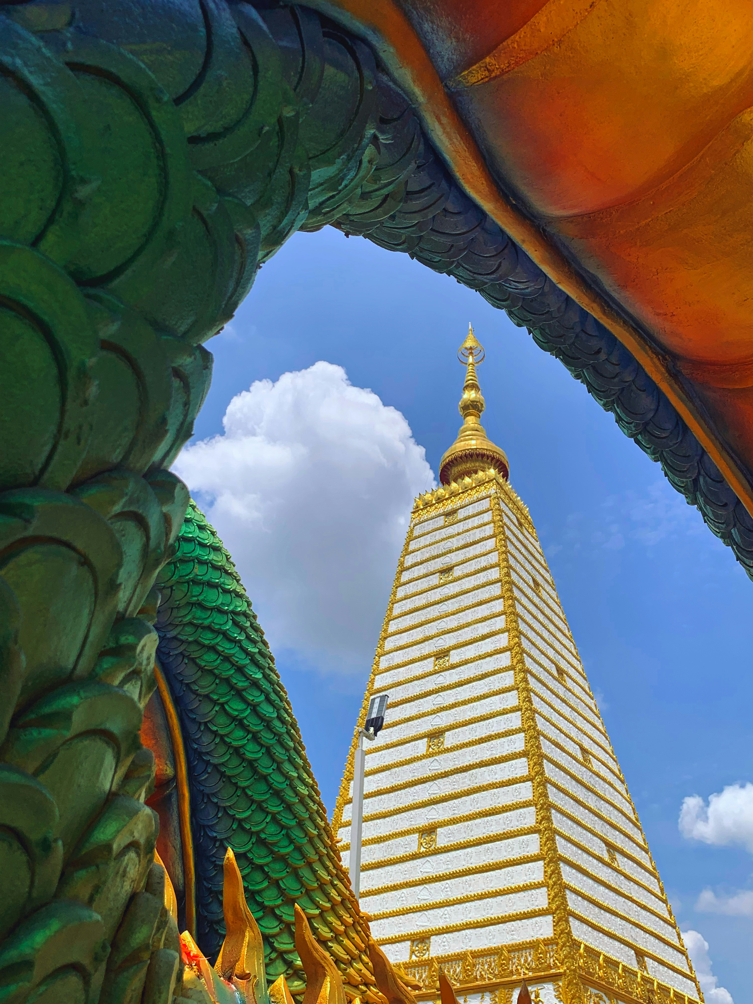 A very tall building with a gold spire photo – Free Thailand Image on ...