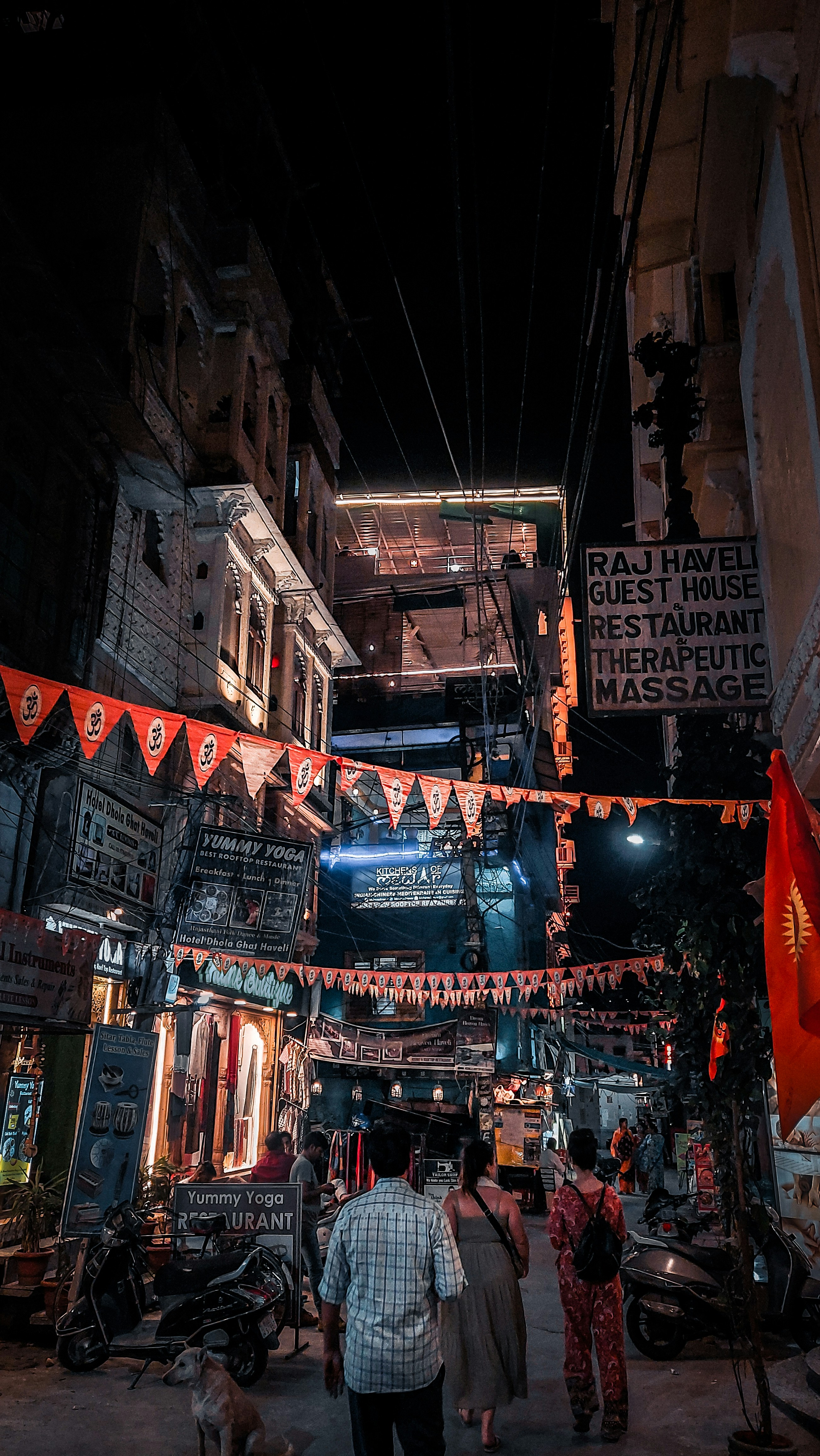 Night Market Corridor with Hanging Flags and Neon Glow
