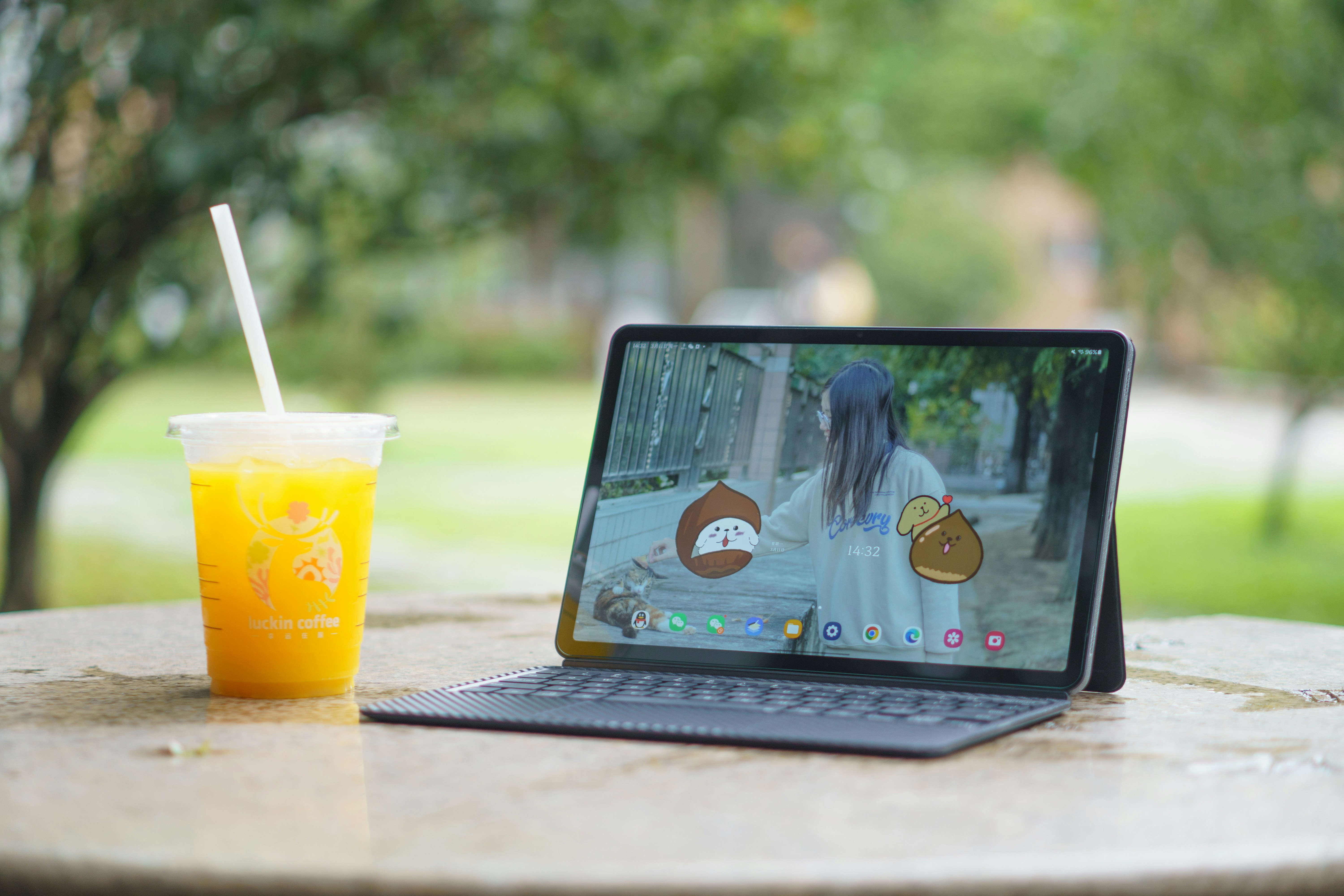 Park Portrait on a Tablet: Sunlit Tabletop Scene with Drink and Screen Stickers