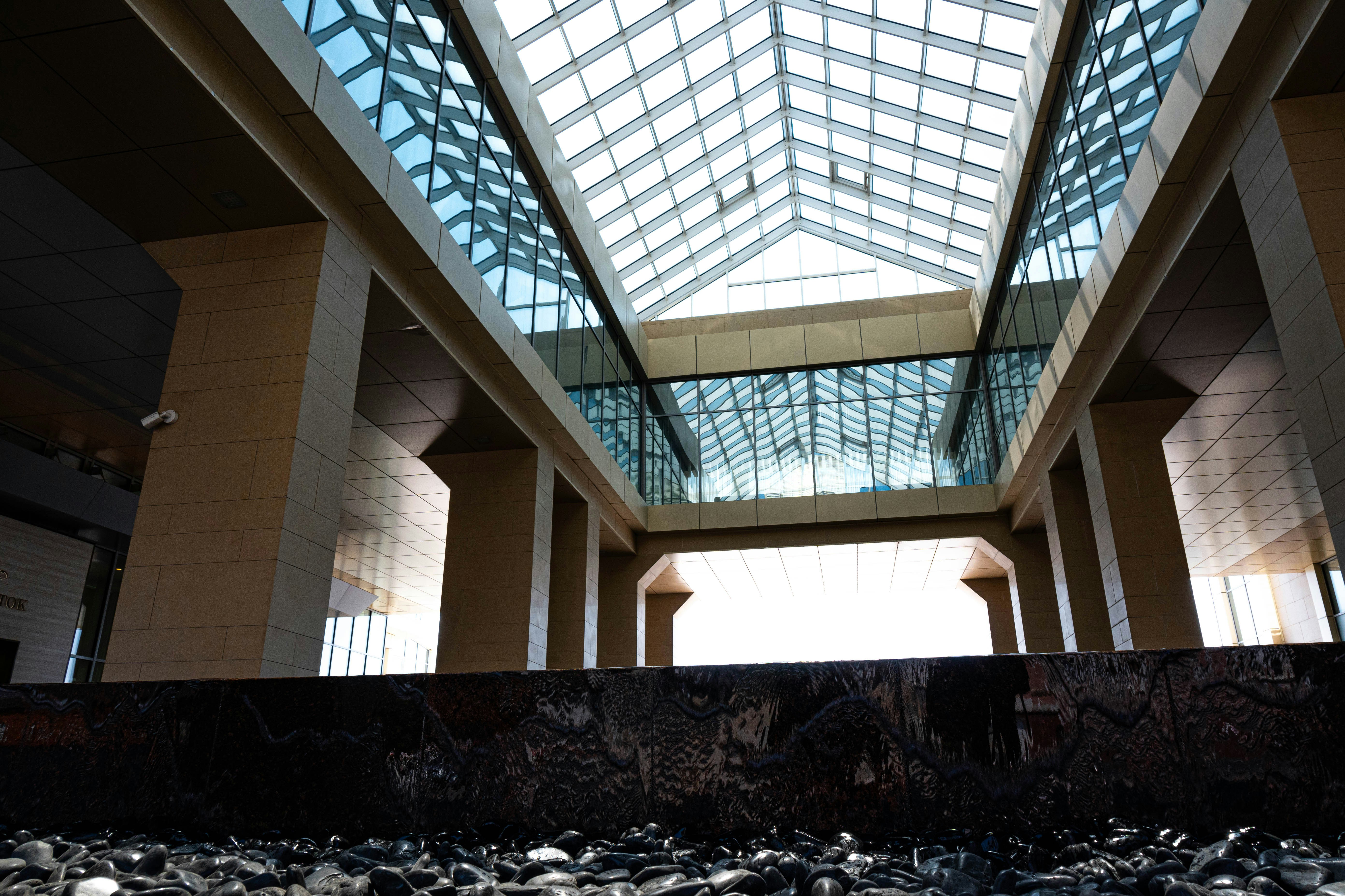 A large atrium with a skylight above it photo – Free Building Image on ...