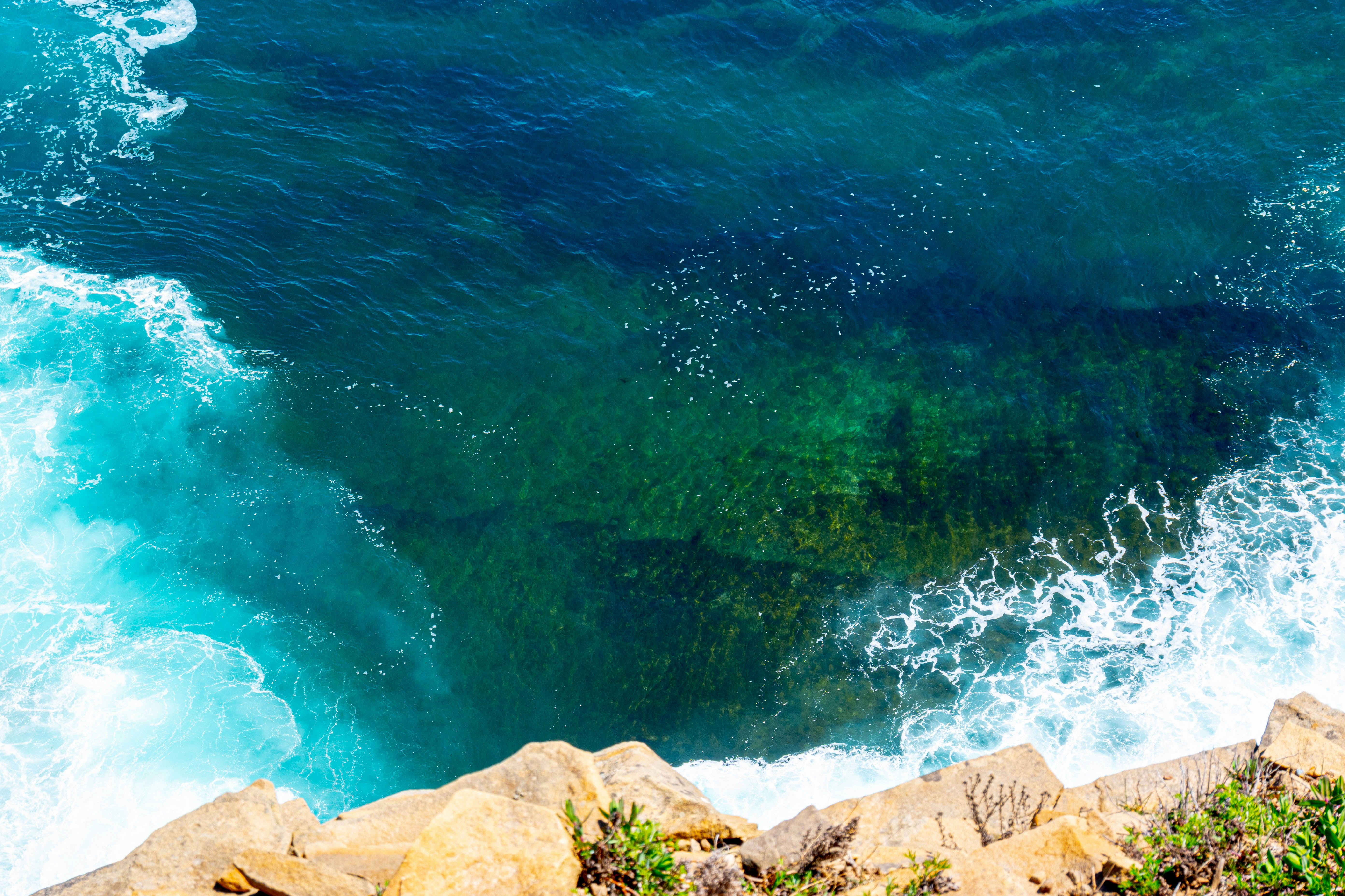 A view of a body of water from above photo – Free Grey Image on Unsplash