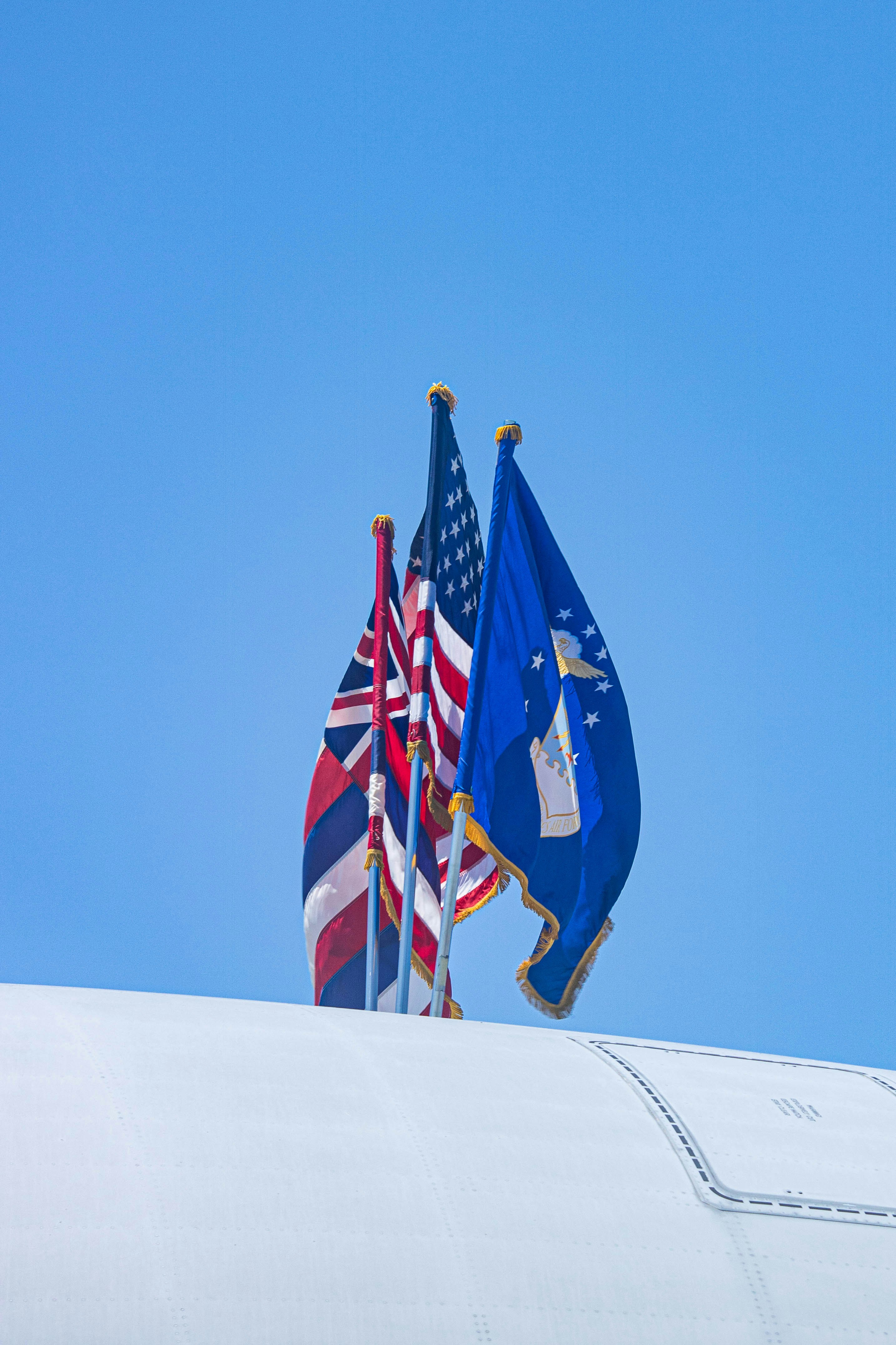 A group of flags flying on top of a snow covered slope photo – Free Usa ...