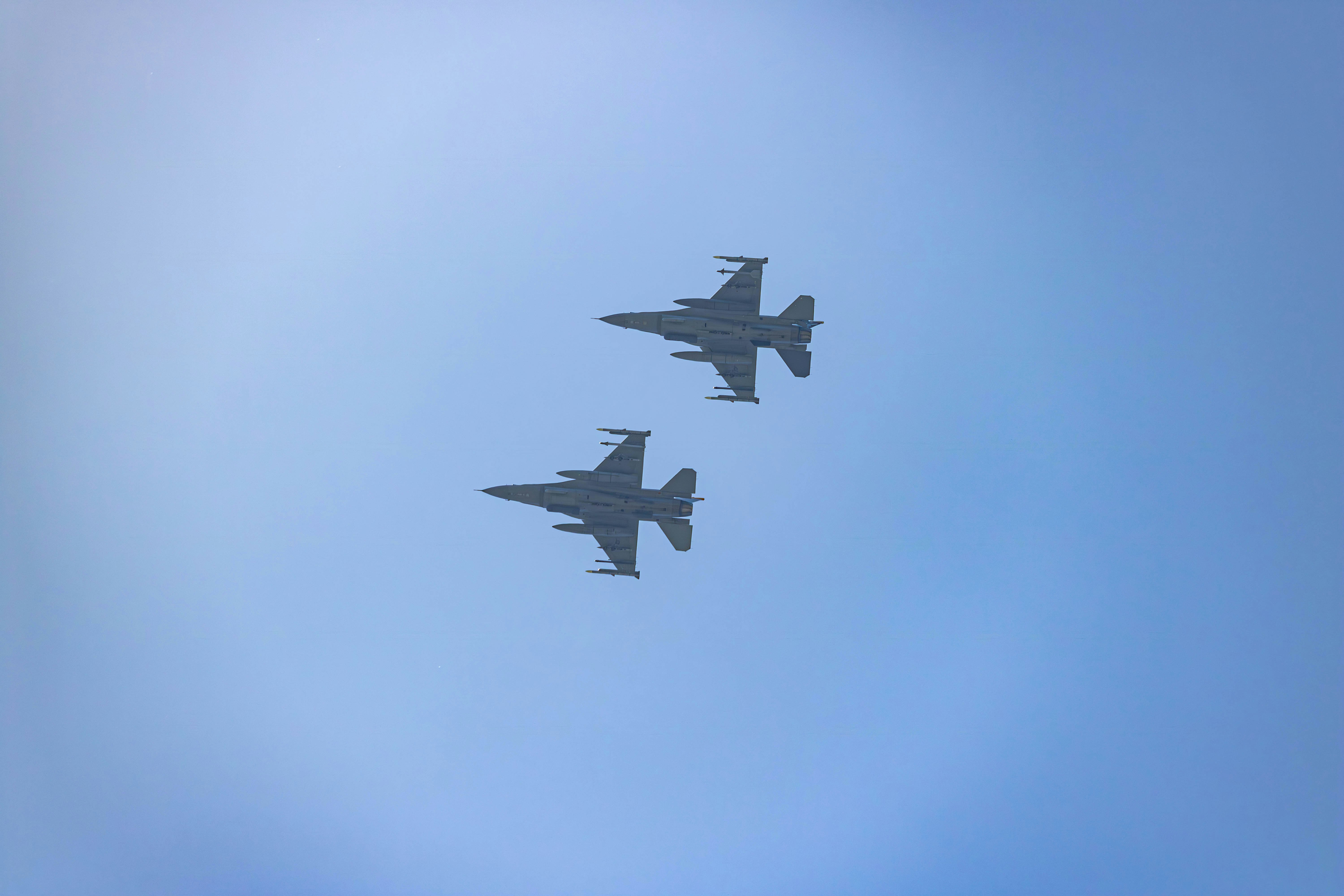 Two fighter jets flying in formation in a blue sky photo – Free Blue ...