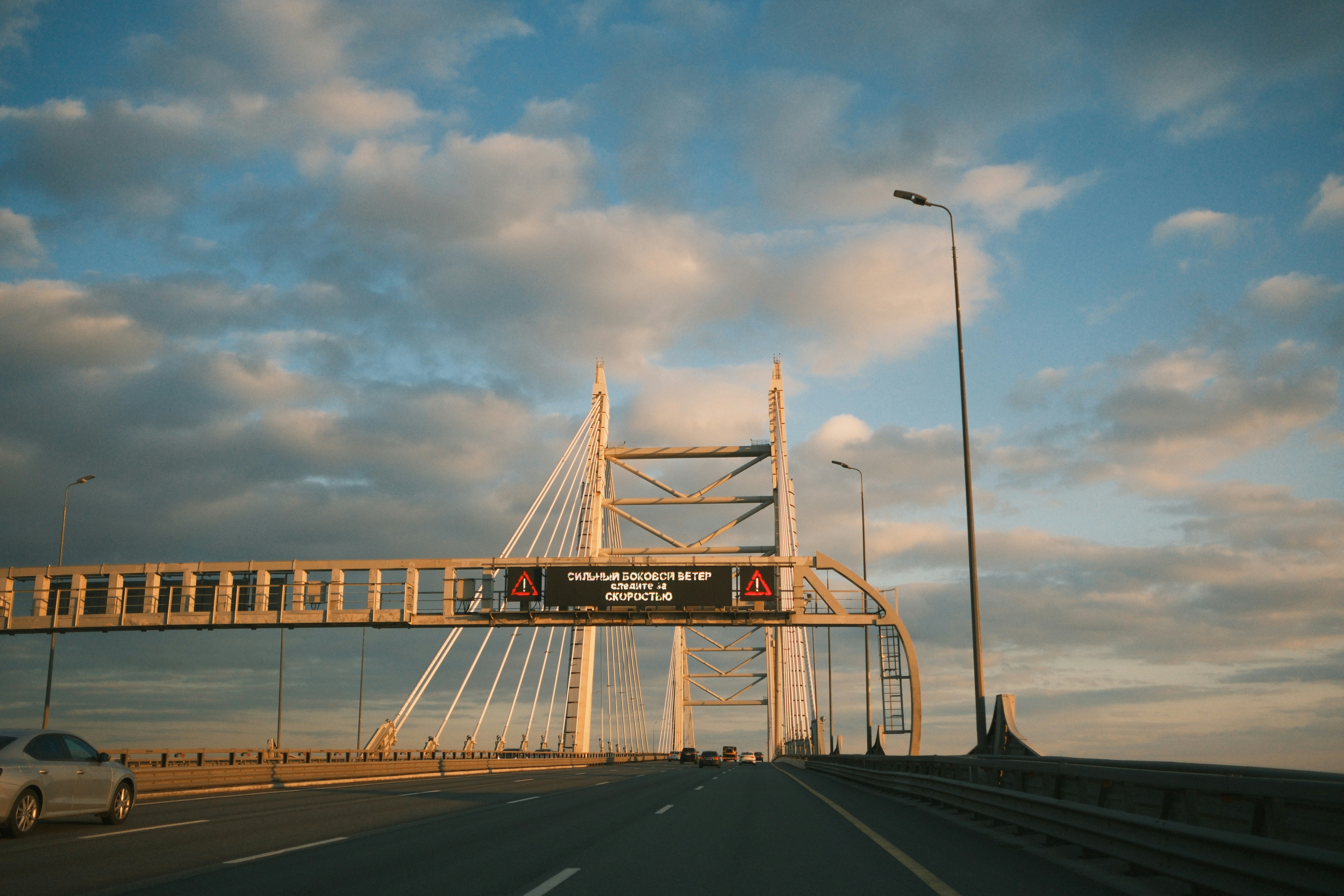 Golden Span at Dusk: A Cable-Stayed Bridge Under Traffic