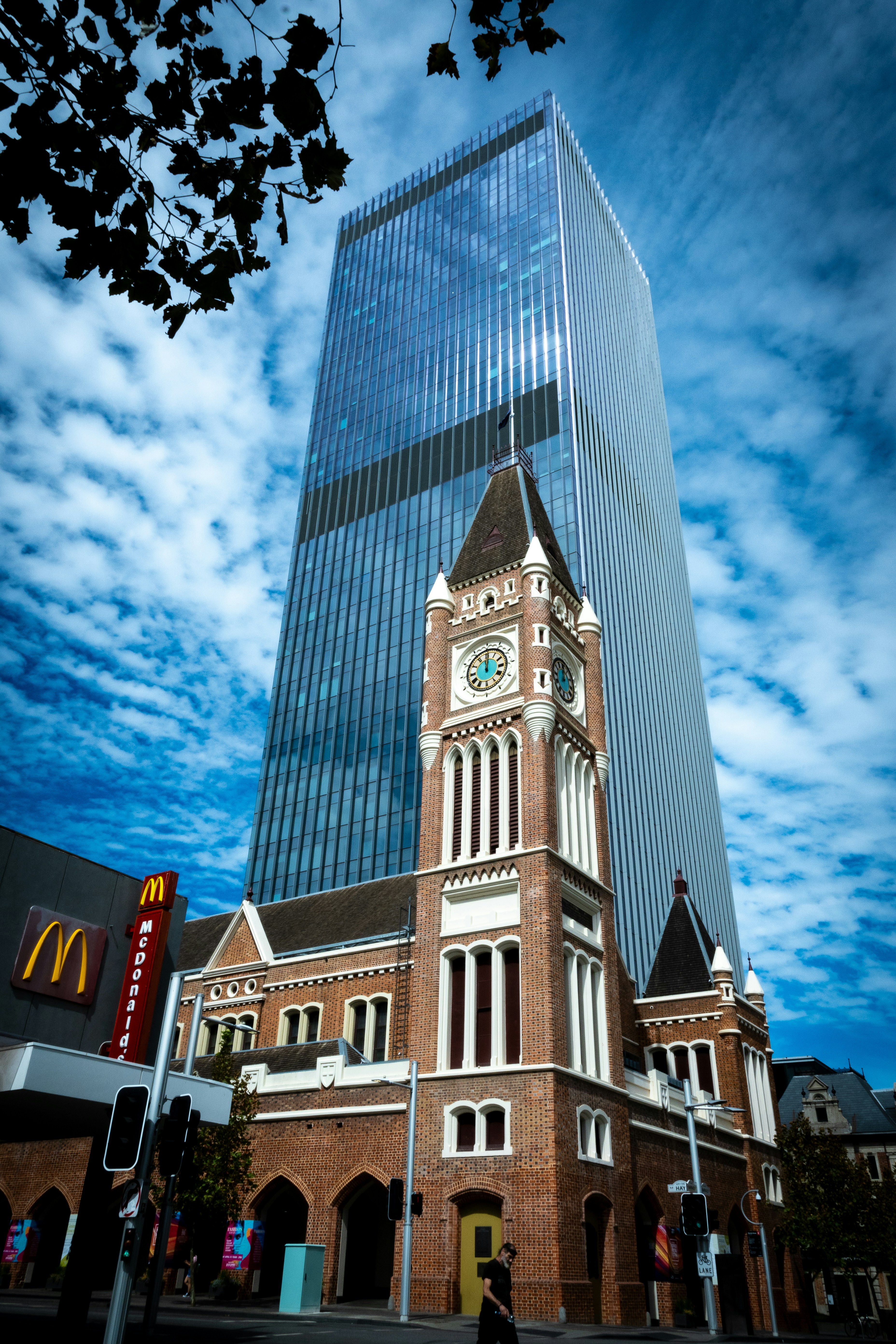 Clock Tower and Glass: A Cityscape Duel of Brick and Steel