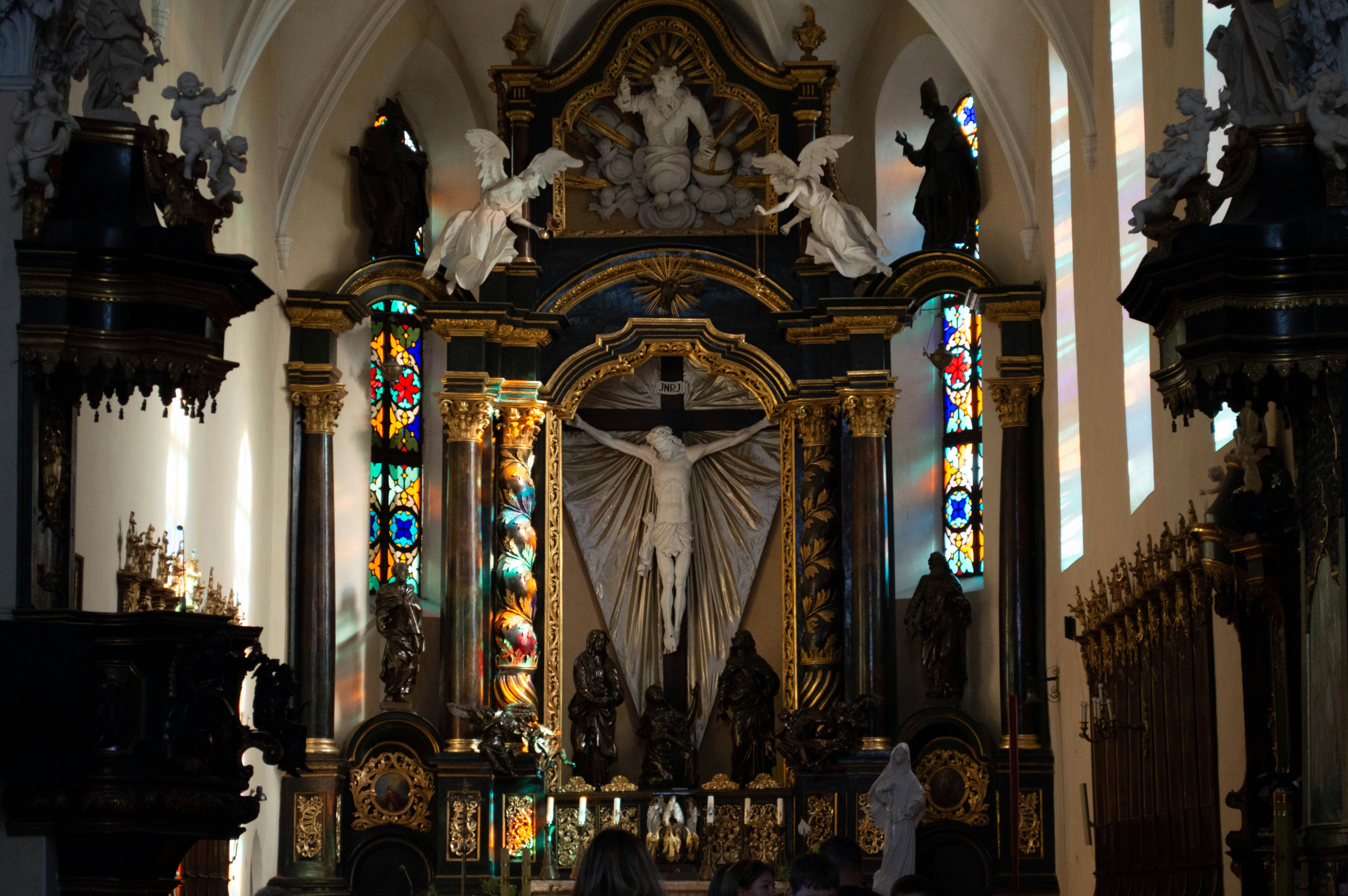 a church with stained glass windows and a crucifix
