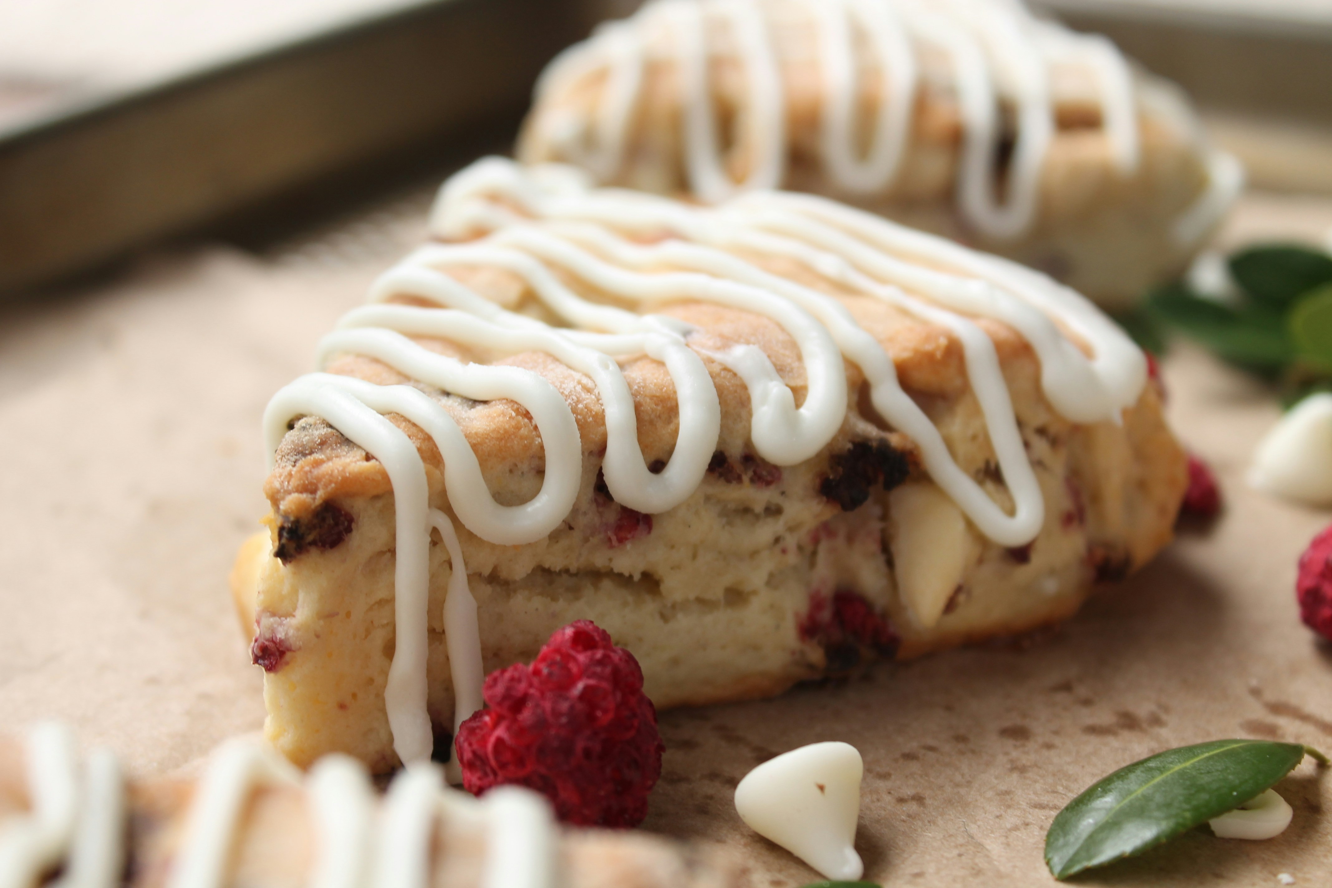 A close up of a pastry with icing and raspberries photo – Free Pastry ...