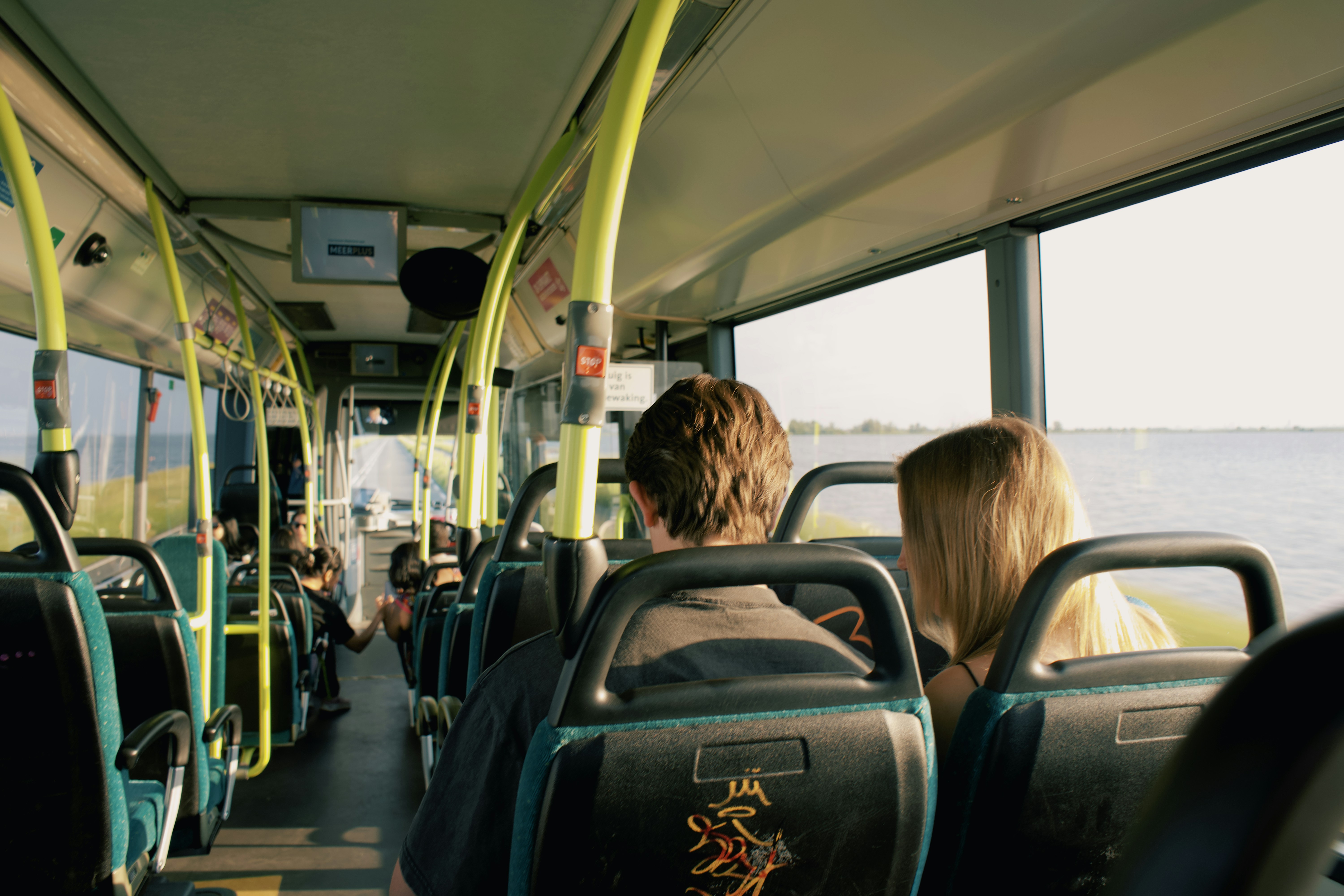 A group of people riding on top of a bus photo – Free Zaandam Image on ...