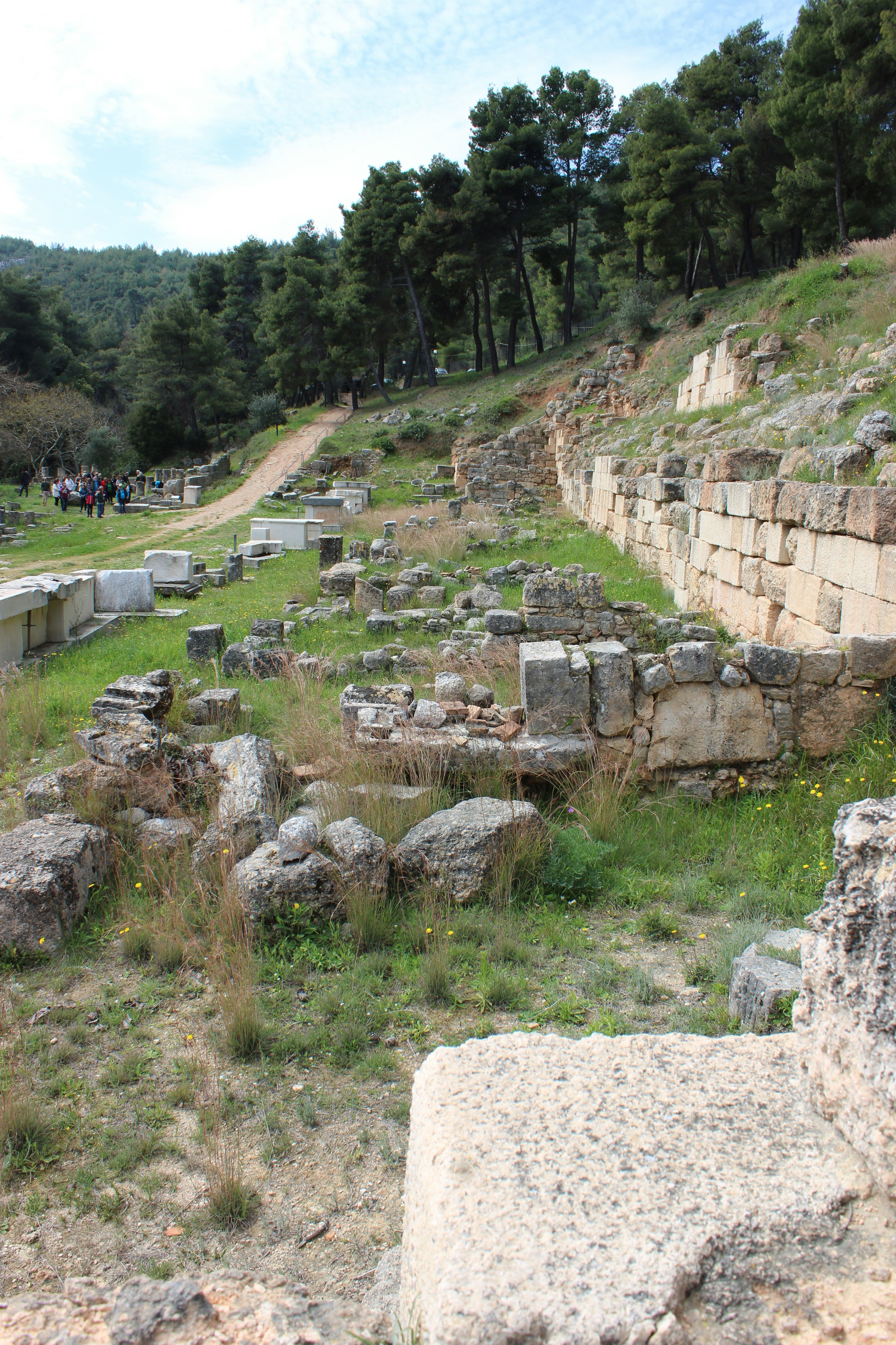 the ruins of a roman city with people walking around