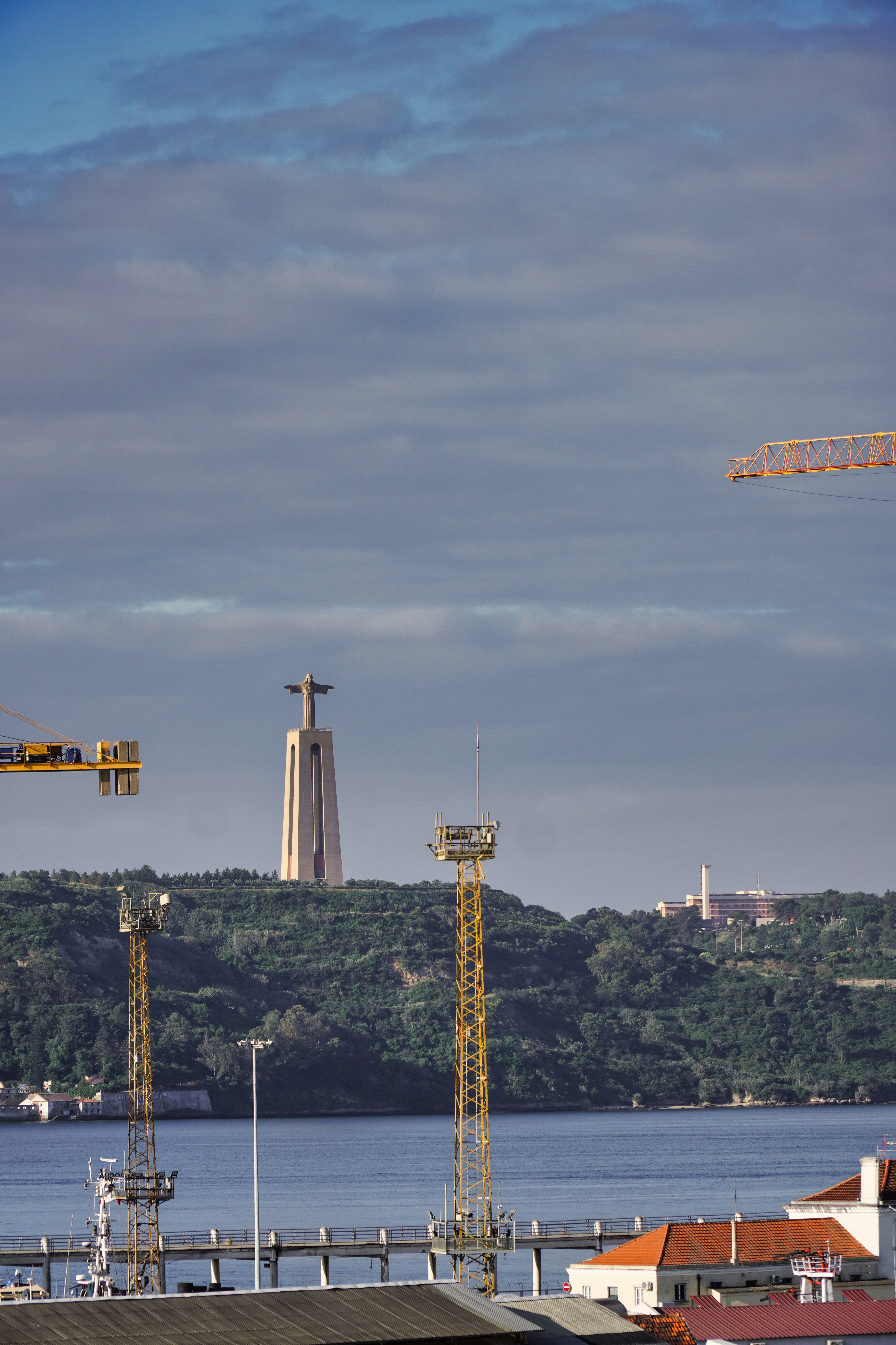 Harbor Crane Silhouette under a Quiet Coastal Sky