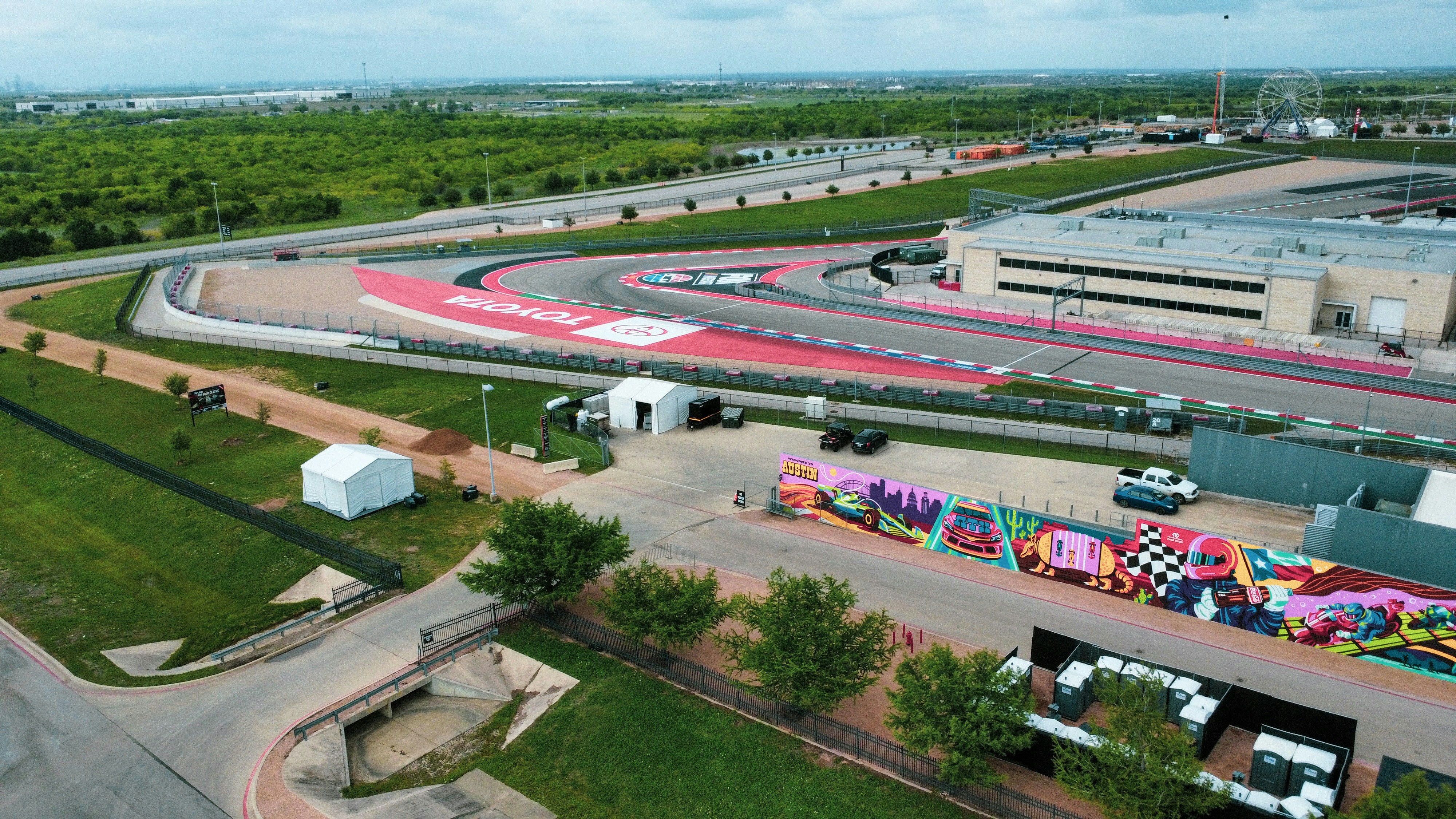 An aerial view of a race track with cars driving on it photo – Free Car ...