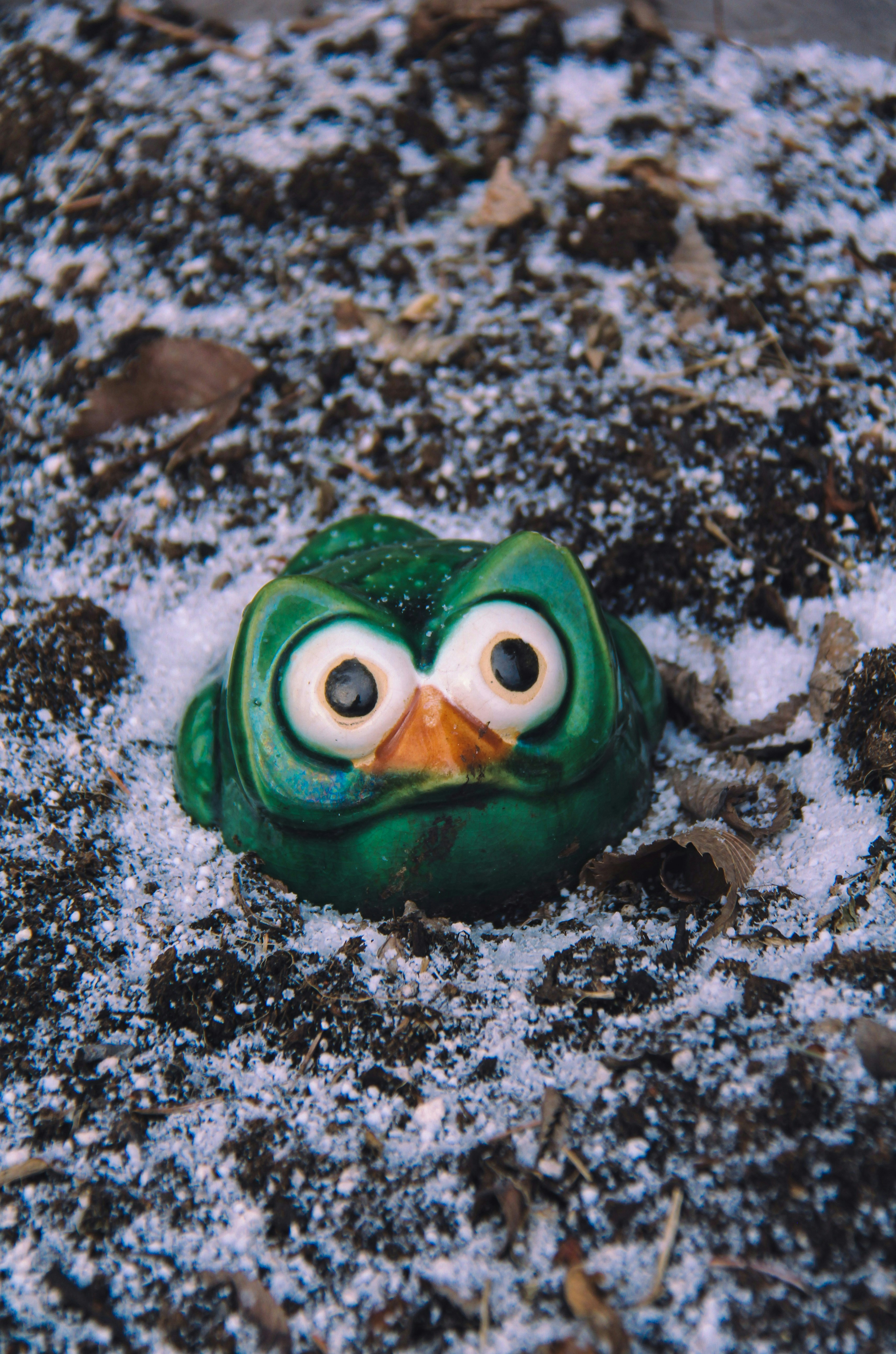 Emerald Penguin Figurine Peeking Through Frosty Ground