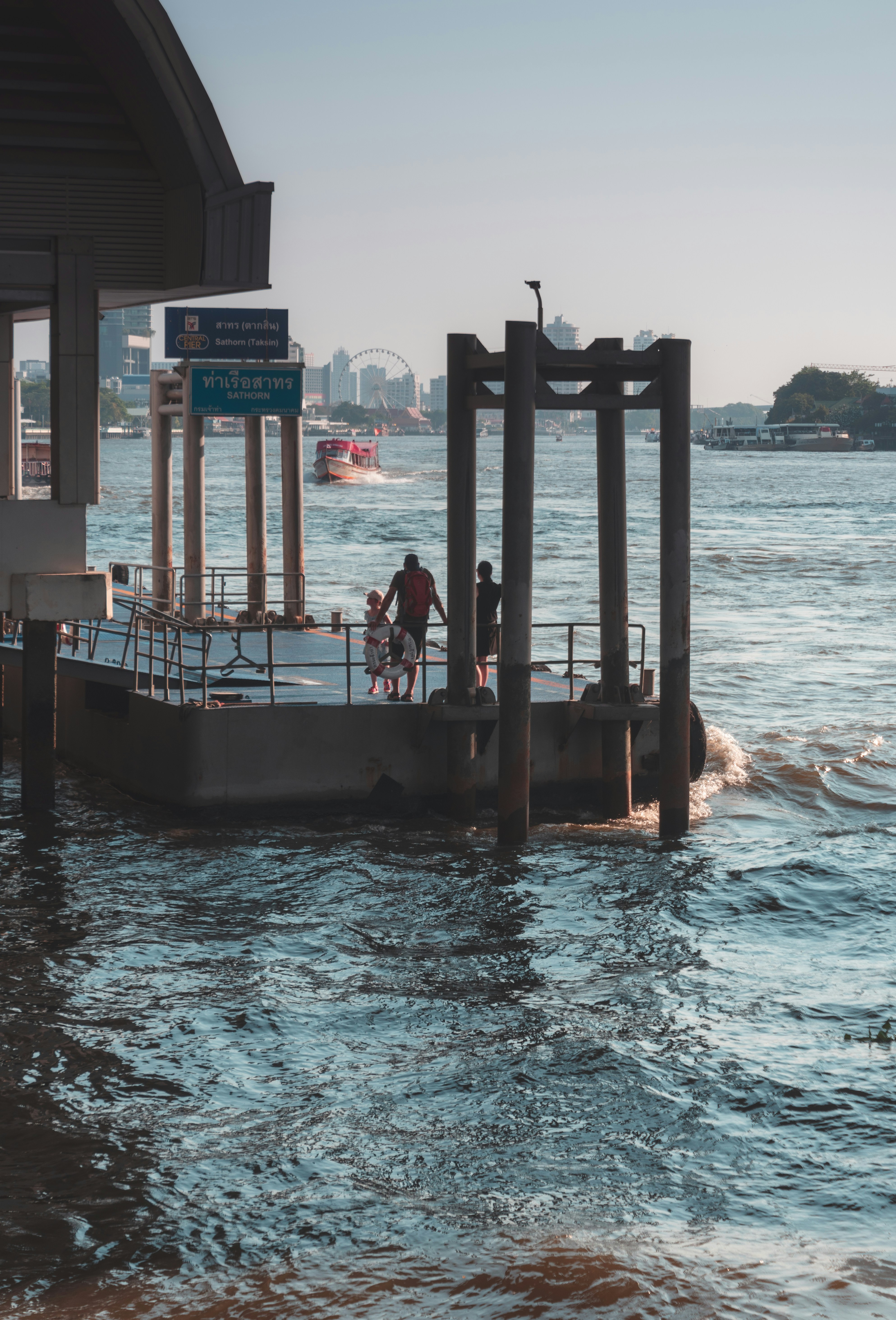 Harbor Platform at Dusk: Family Crossing to the Ferry