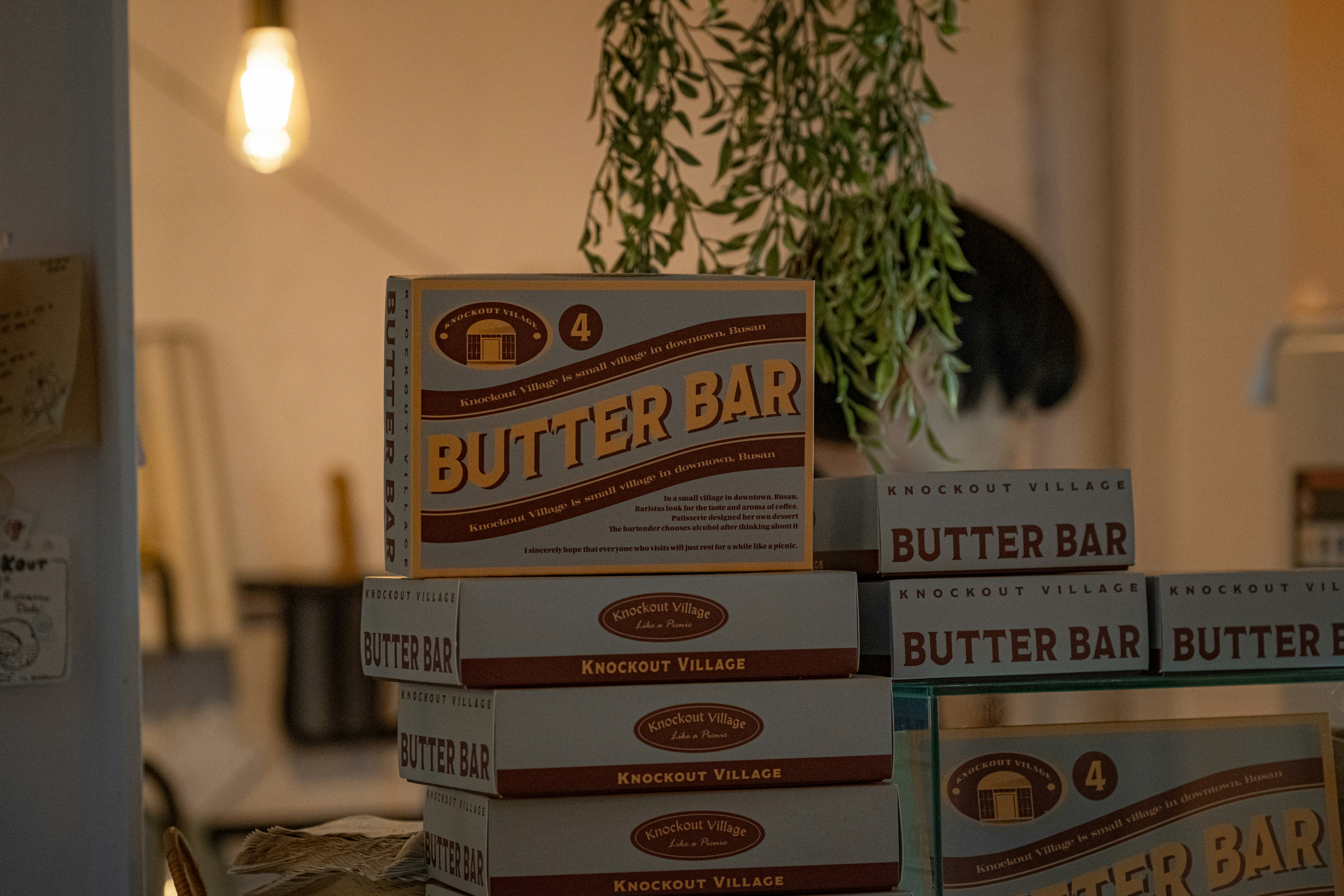 A stack of butter bar boxes sitting on top of a counter photo – Free ...