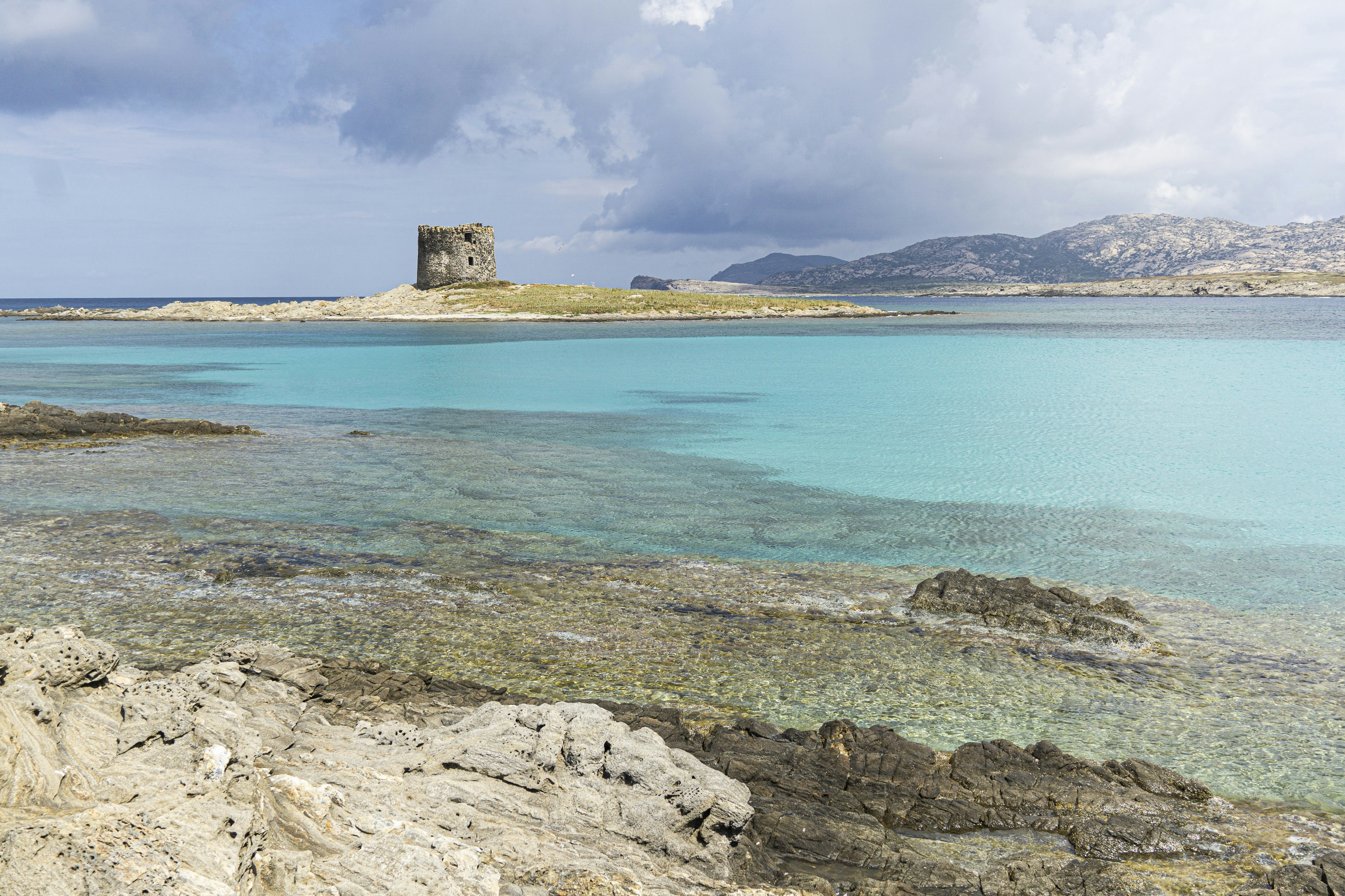 Turquoise Sands and a Sentinel Tower
