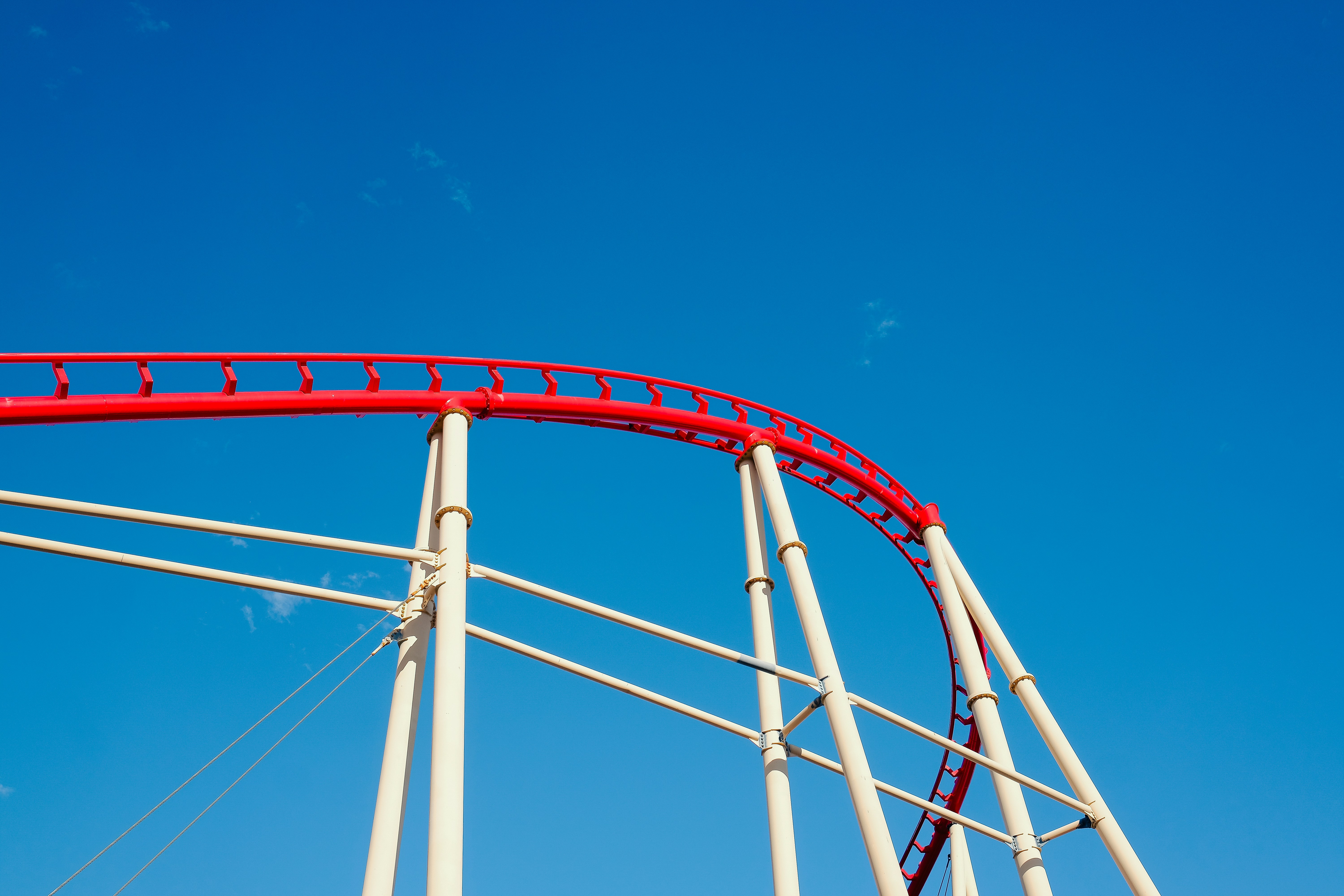 A red roller coaster against a blue sky photo – Free Roller coaster ...