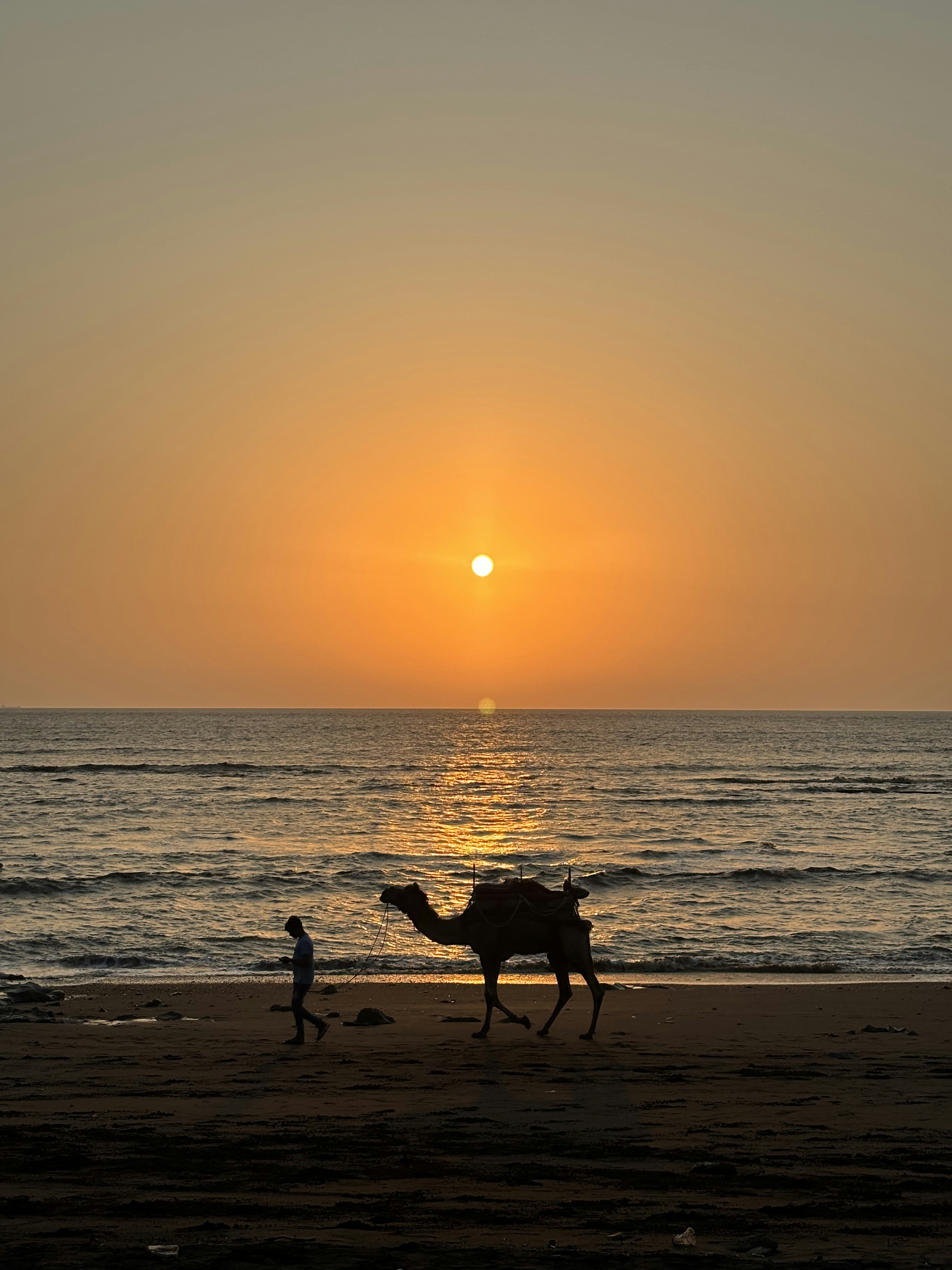 Sunlit Caravan on a Quiet Beach at Dusk