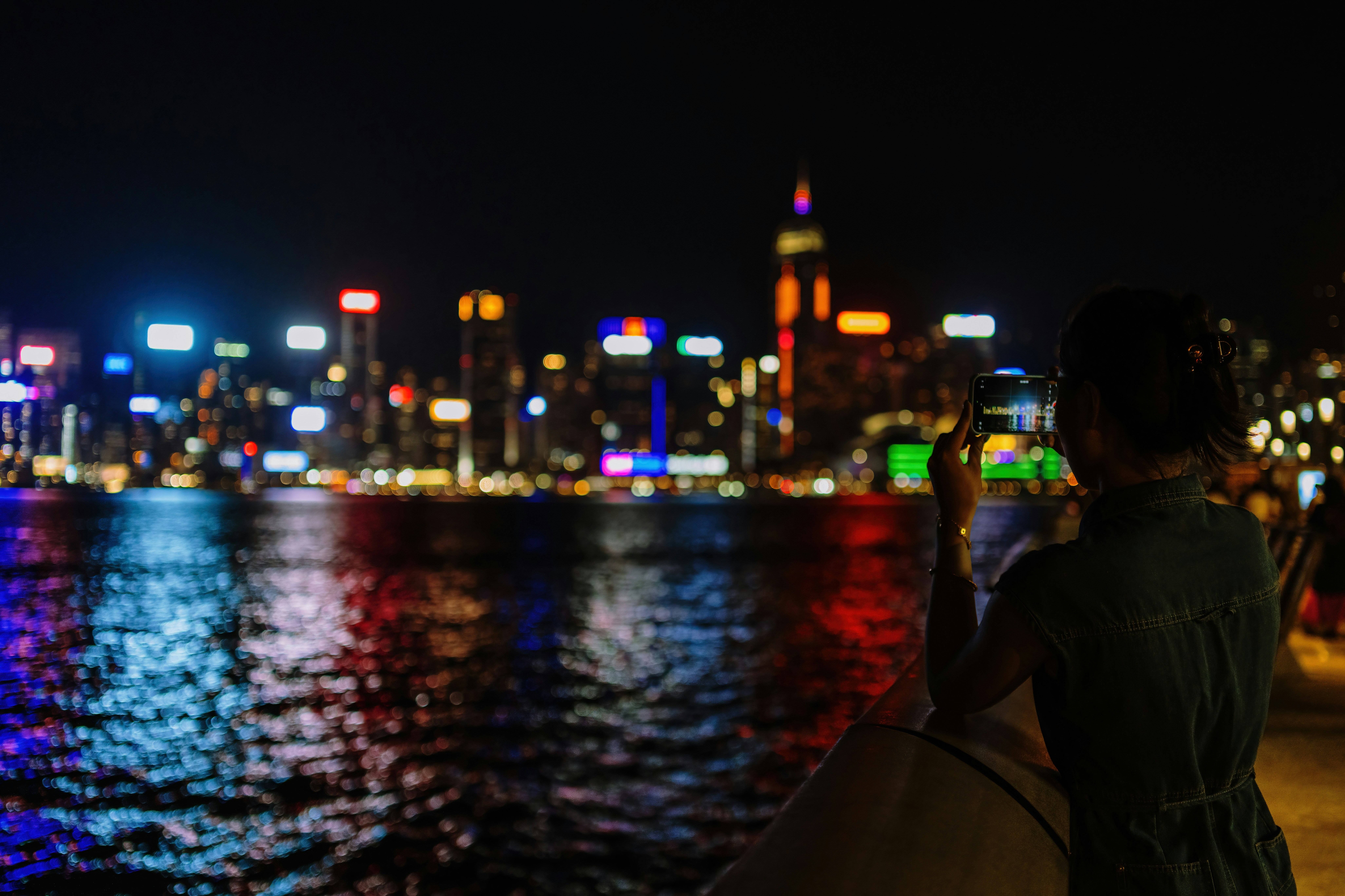 Neon Harbor Sketch: A Night Photographer Frames the City Lights Across the Water