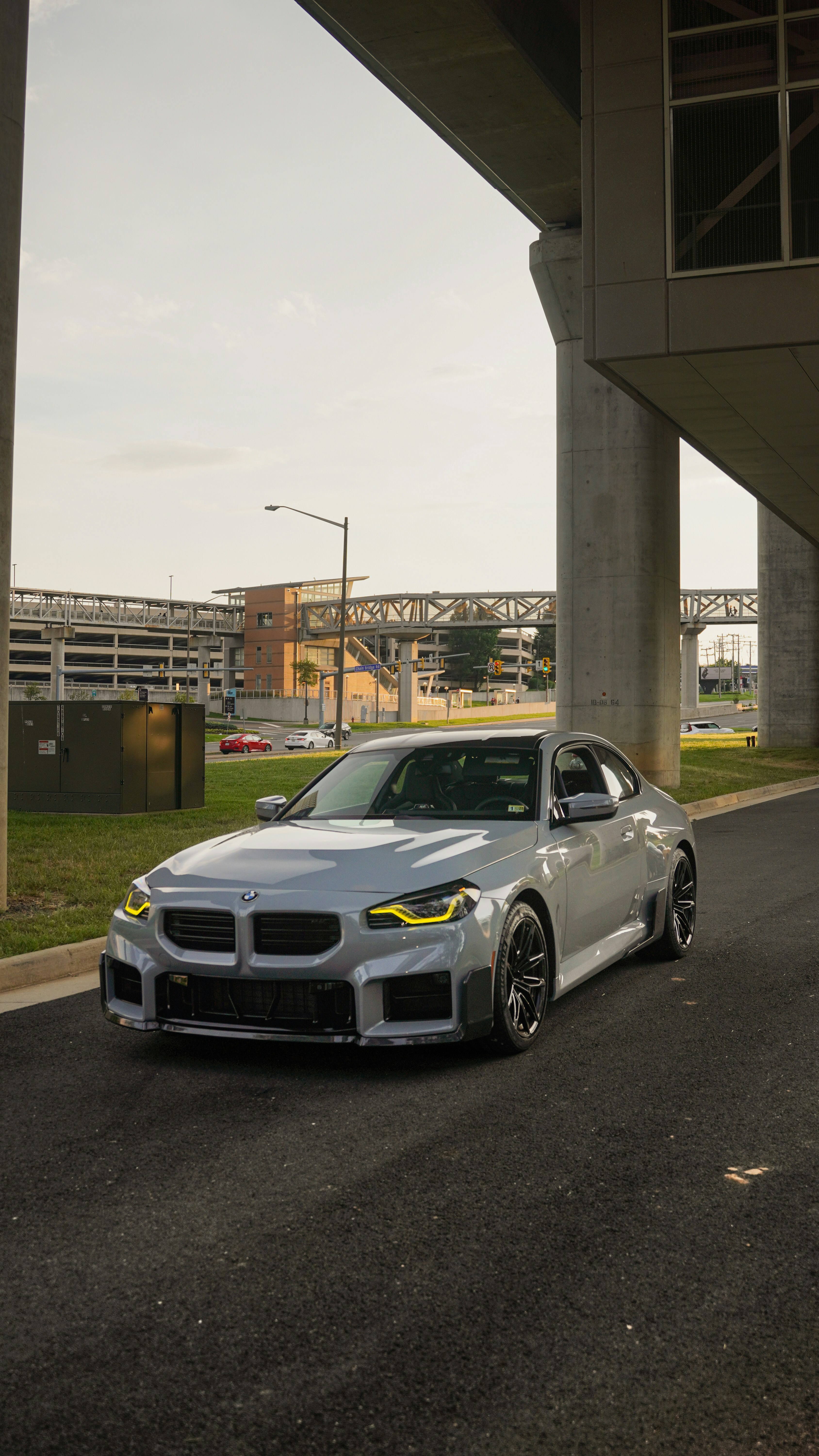 A silver sports car driving under a bridge photo – Free Sports car ...