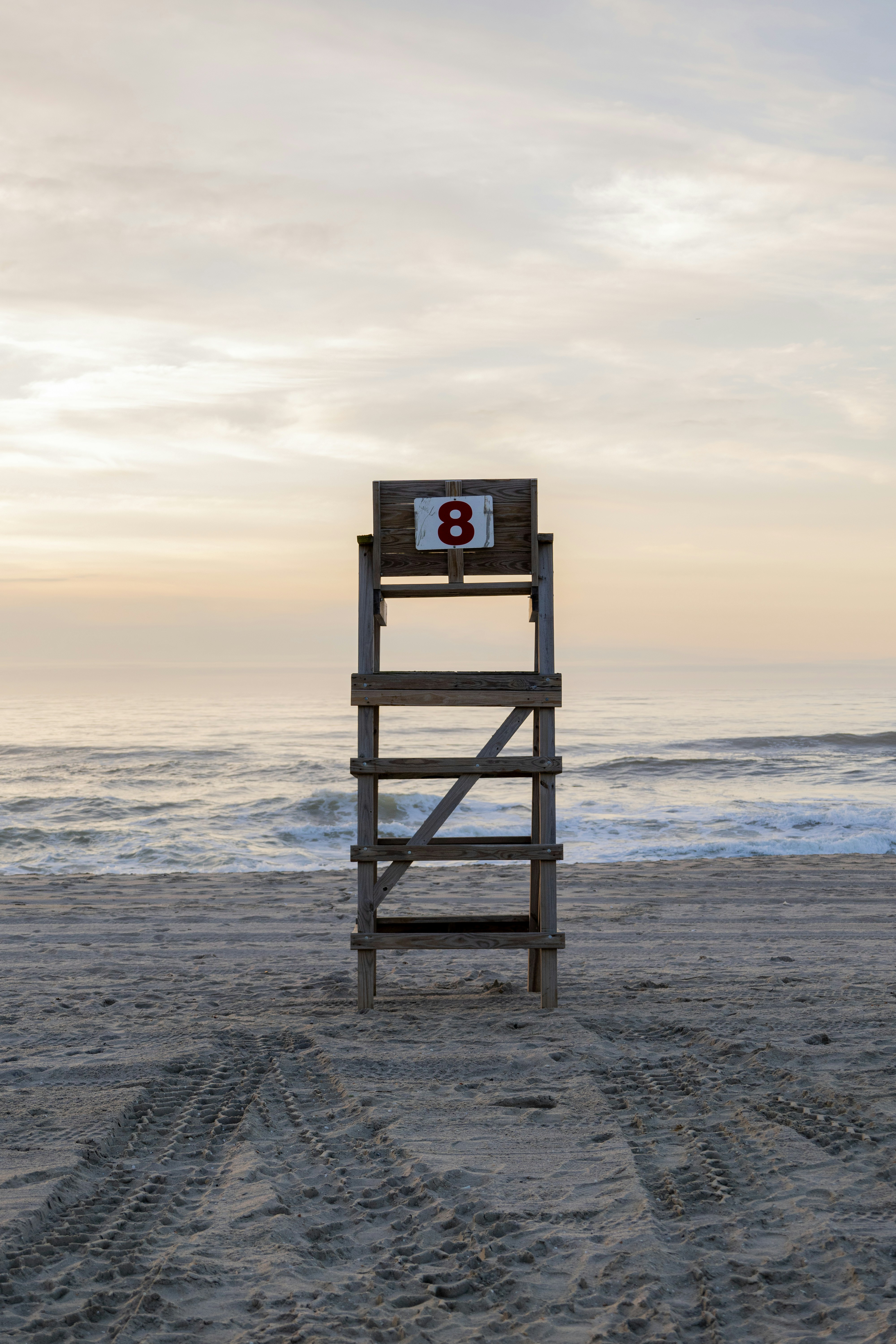 Eight on the Dune: Weathered Lifeguard Tower at Sunset