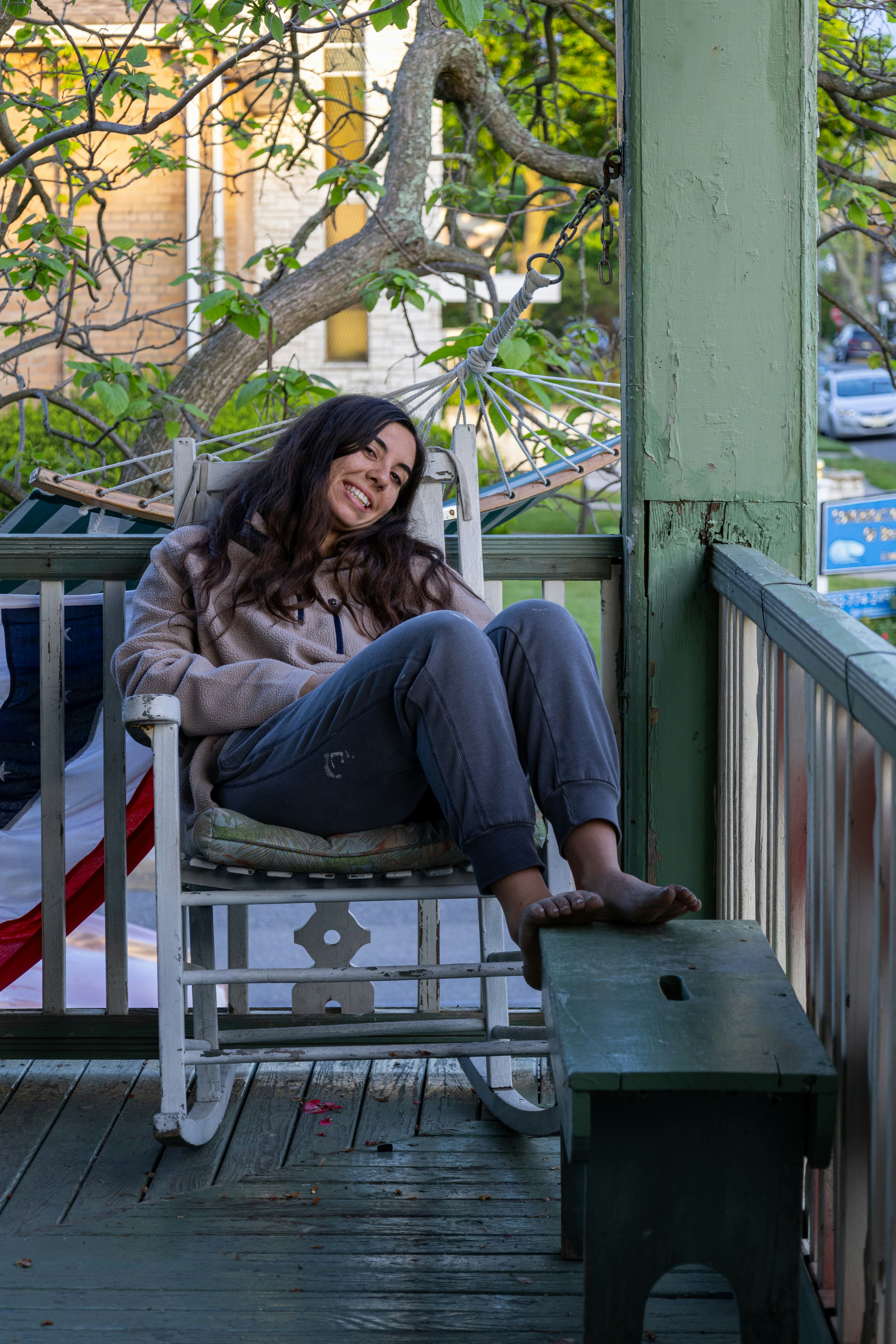 Relaxed Portrait on a Shaded Porch Swing