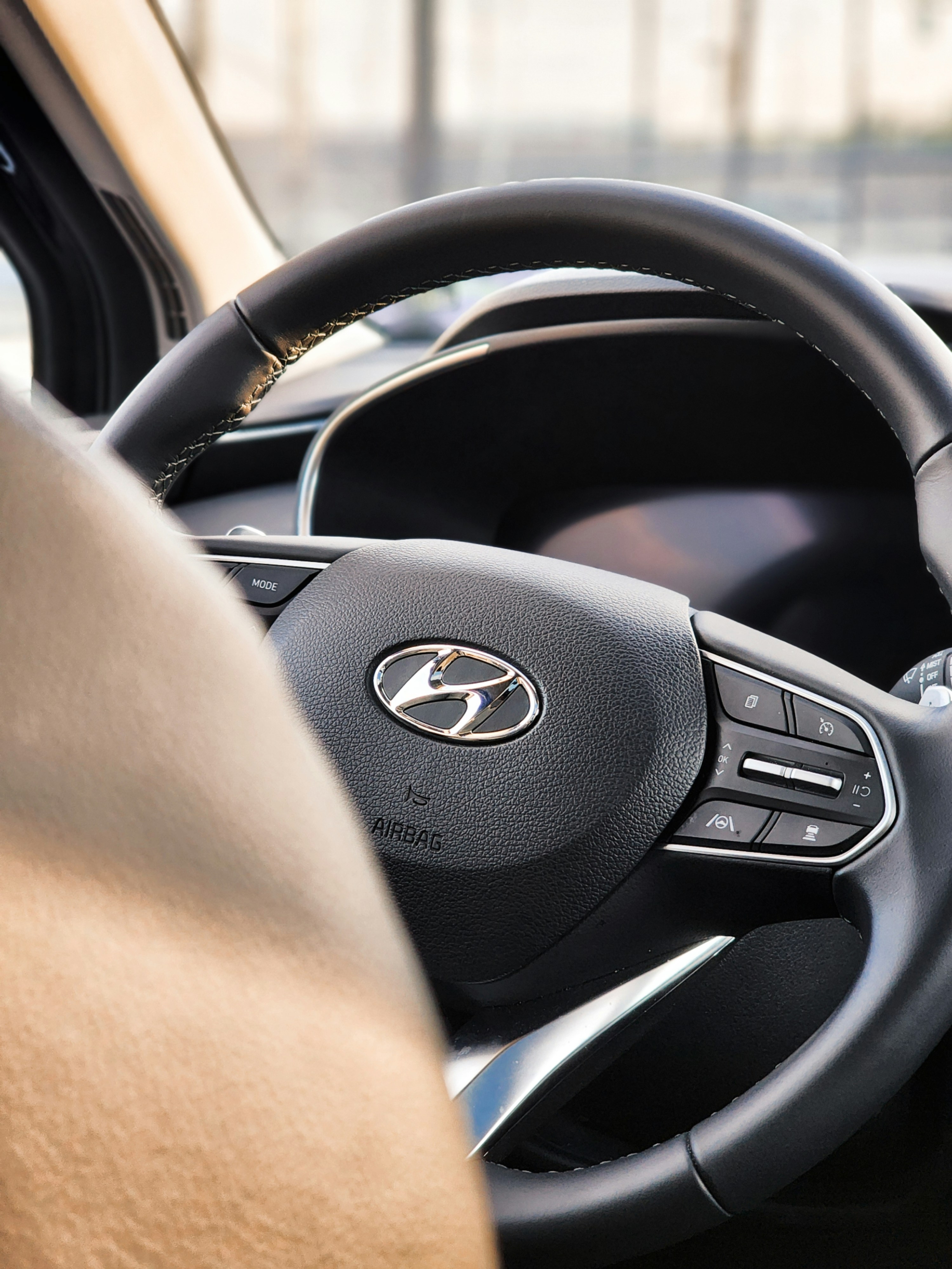 A close up of a steering wheel of a car photo – Free Steering wheel ...