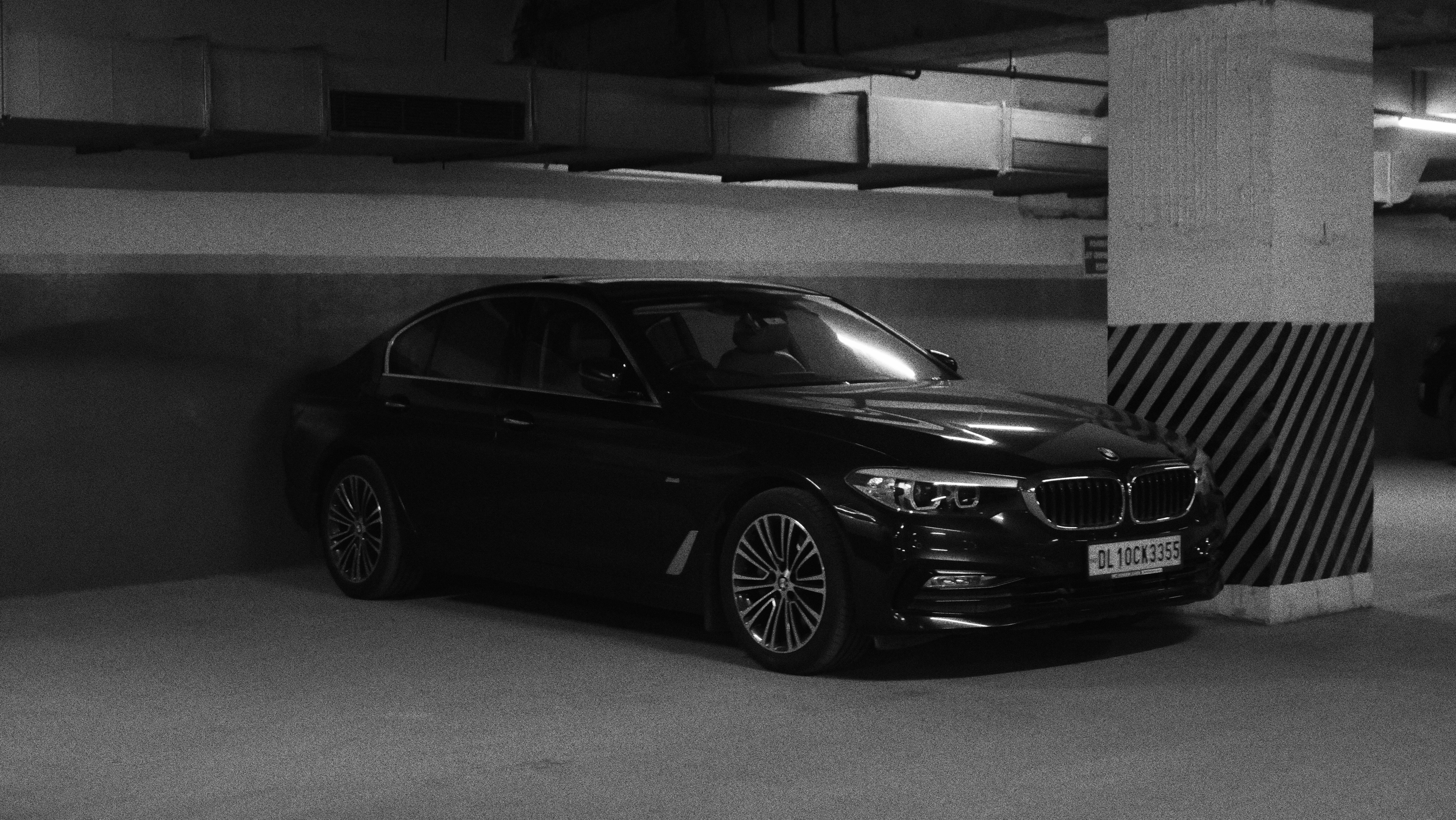 Midnight BMW Lined by Stripes: A Quiet Garage Portrait