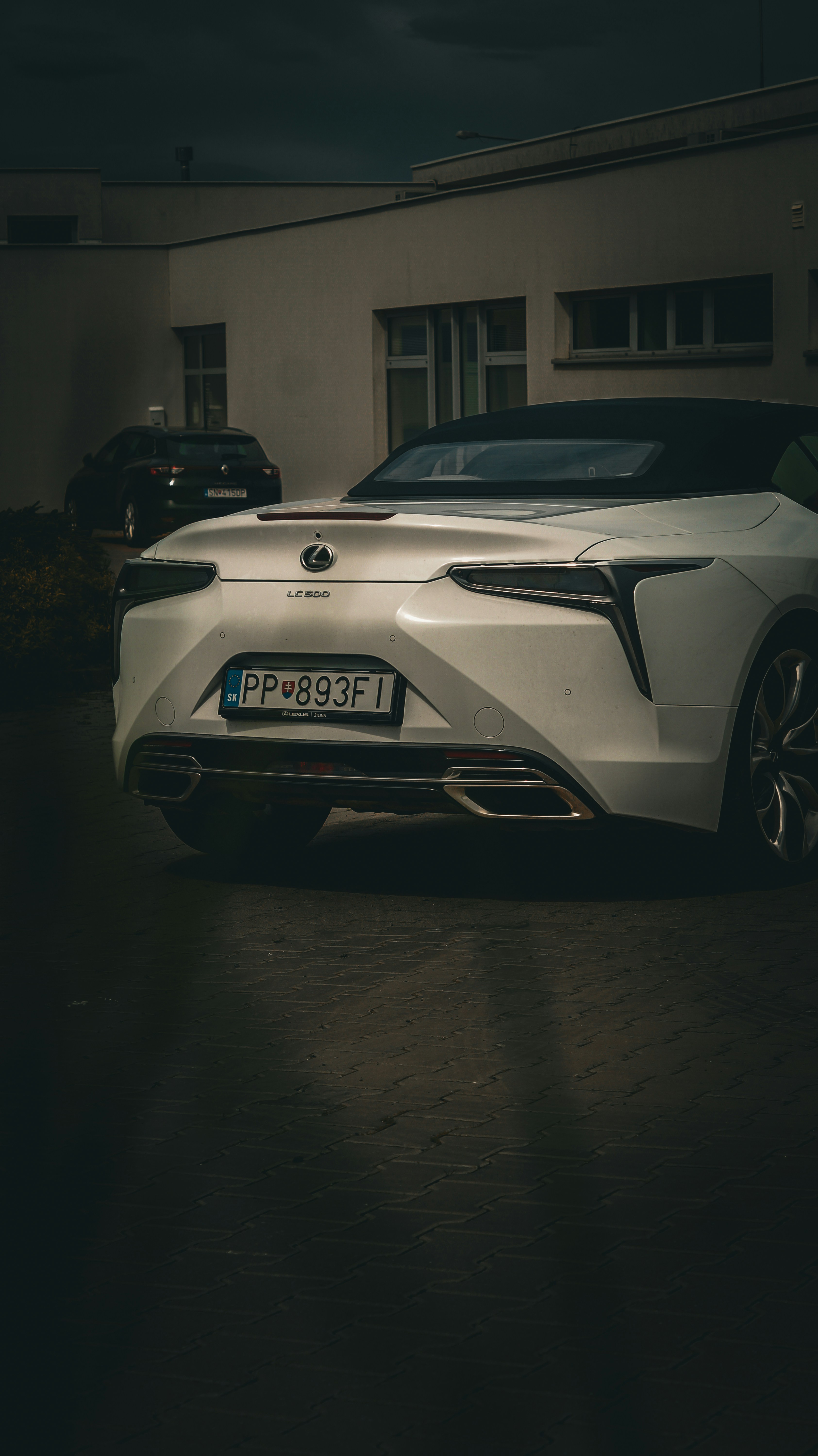 A white sports car parked in front of a building photo – Free Poprad ...