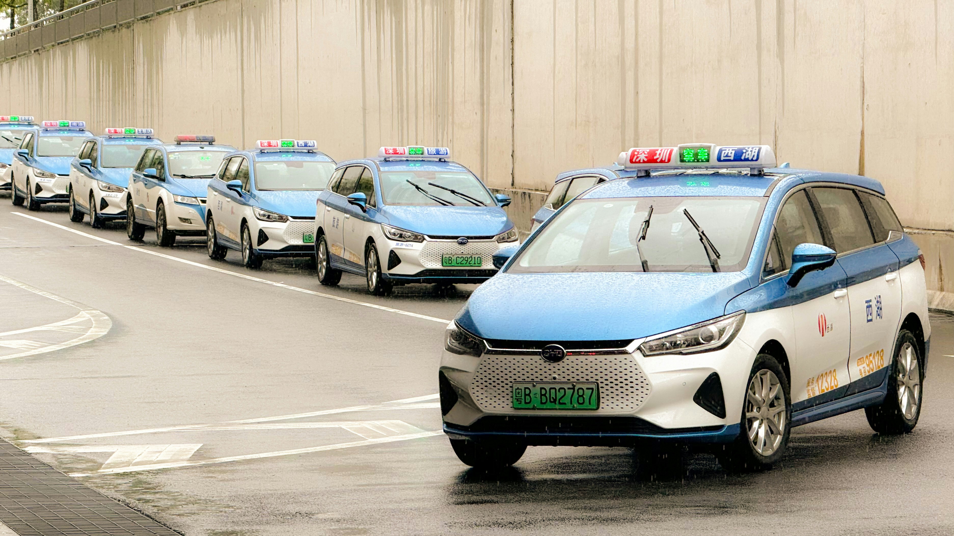 A line of police cars on a city street photo – Free Shenzhen Image on ...