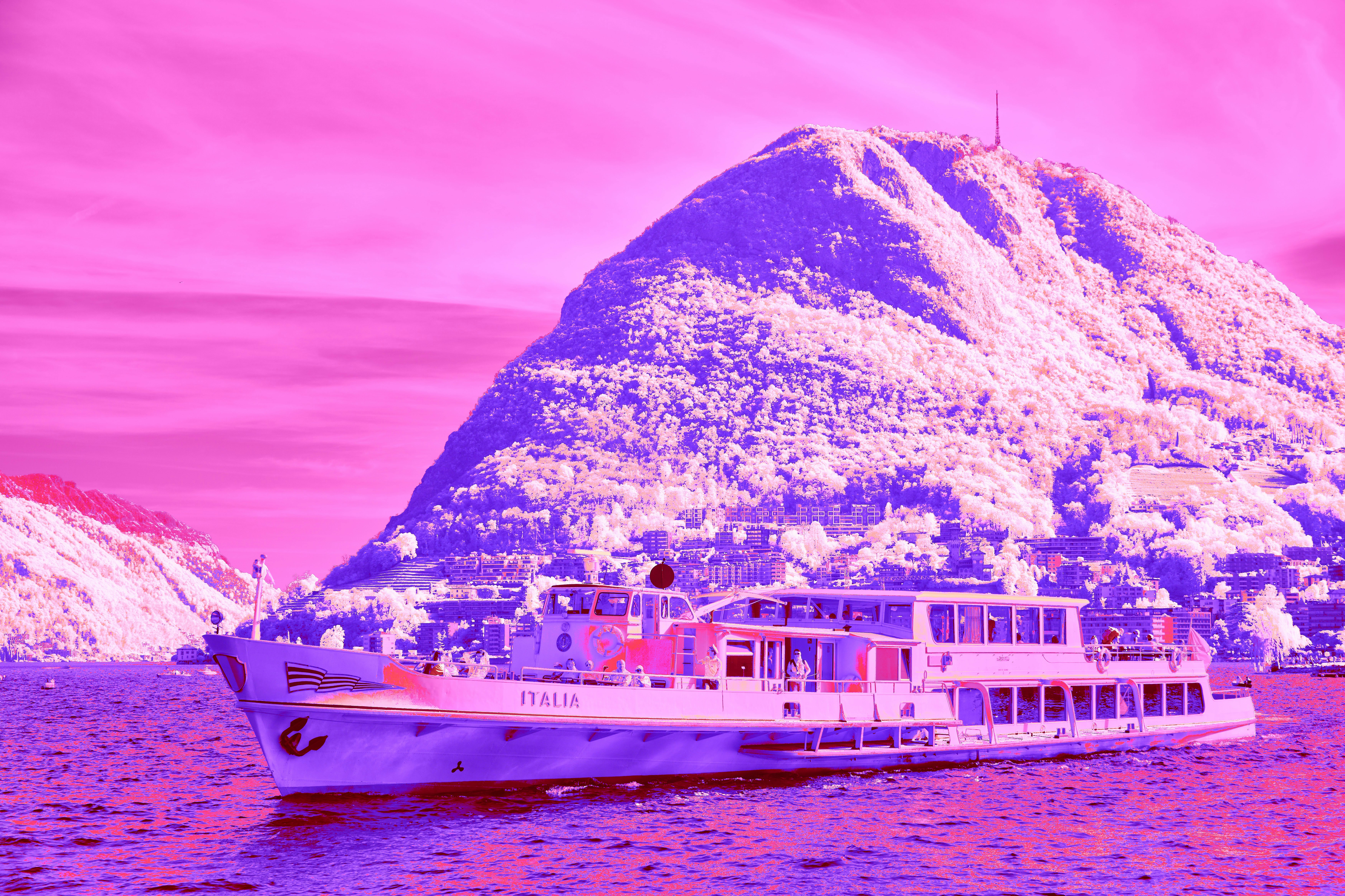 Magenta Harbor Ferry: a pink-hued voyage before a sculpted hill
