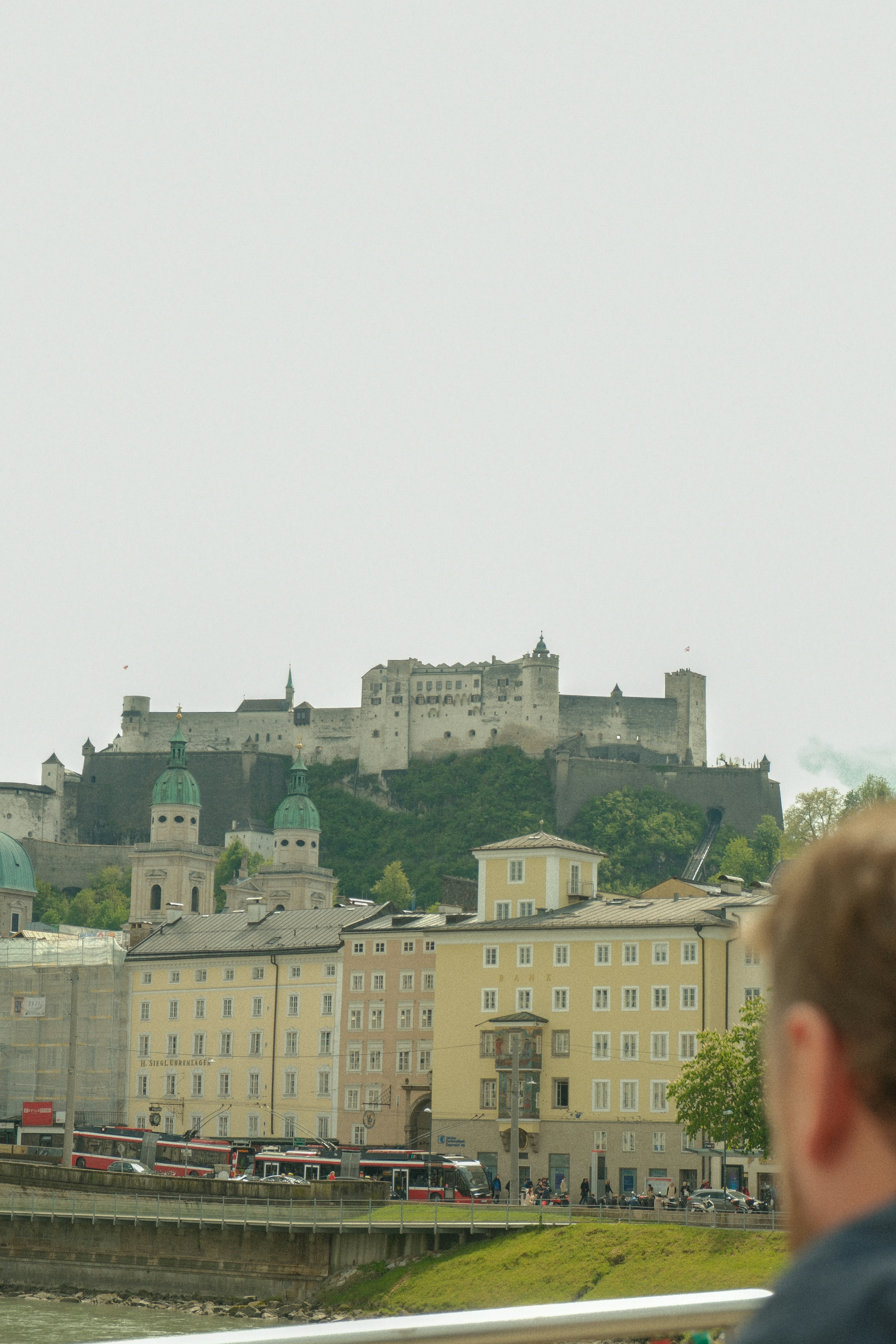 Fortress on the Hill: Hohensalzburg Over a Pastel Salzburg Riverside