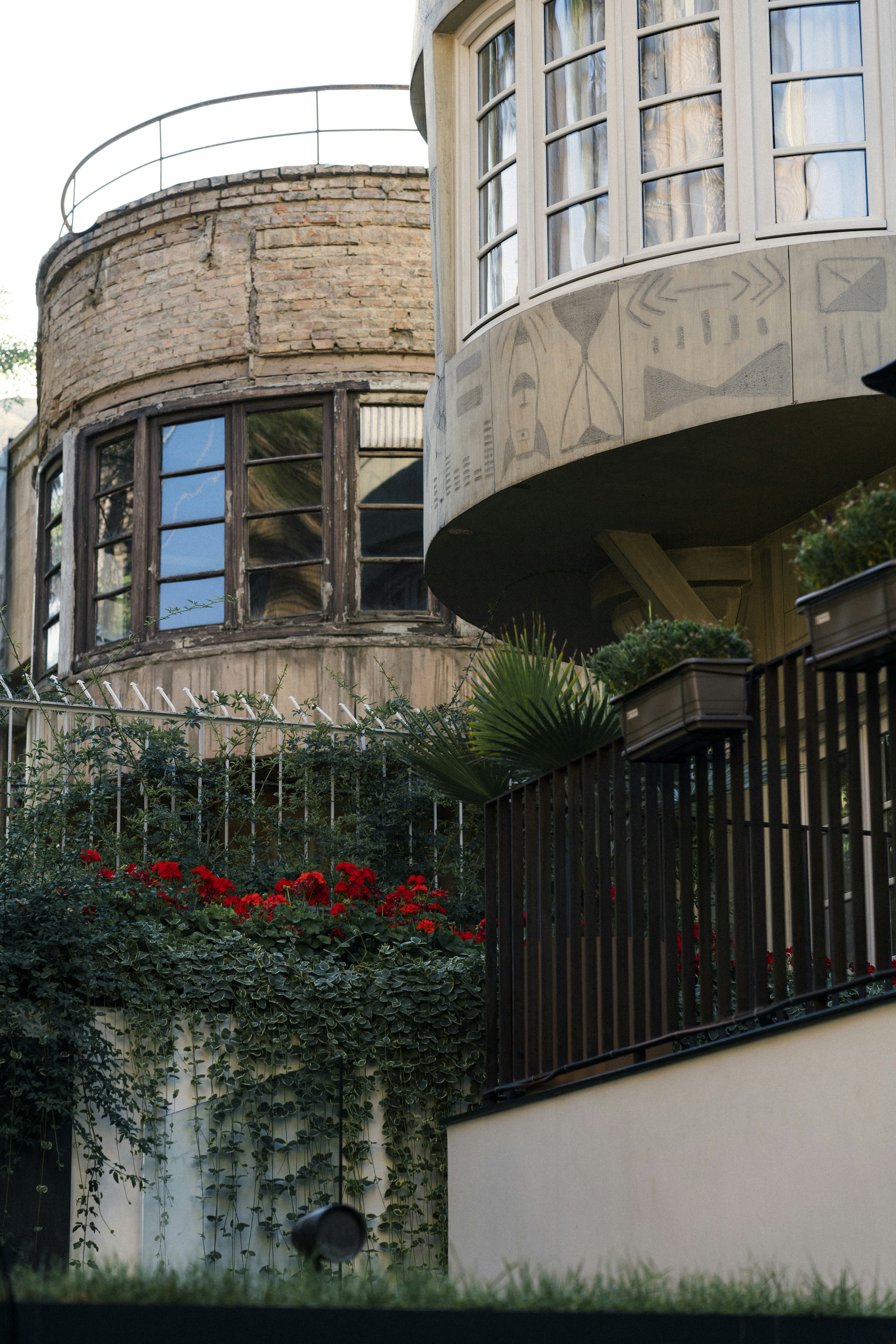Curved Terrace, Weathered Brick, and Flowered Fence