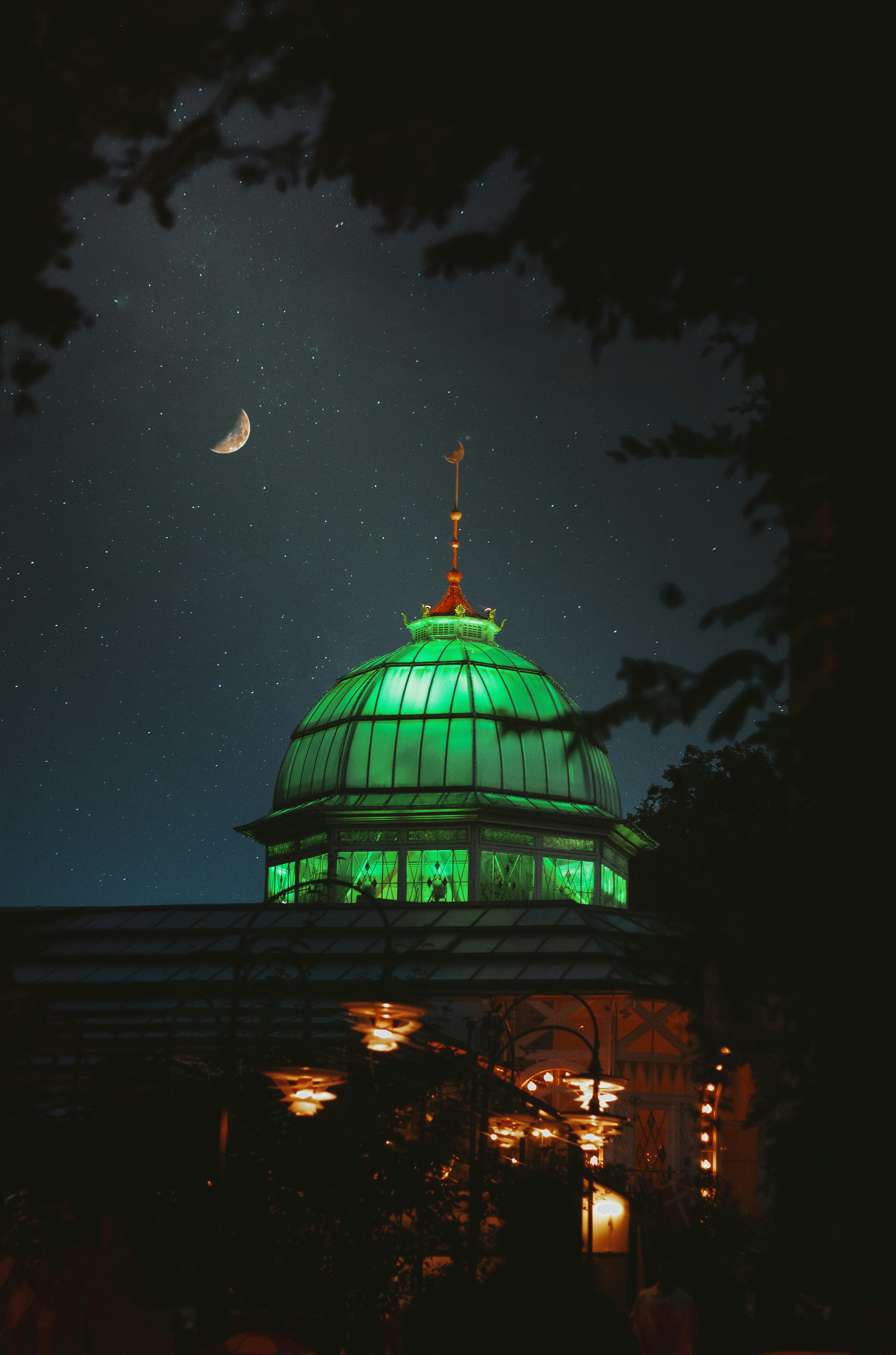 Emerald Dome Under a Velvet Night with a Crescent Moon