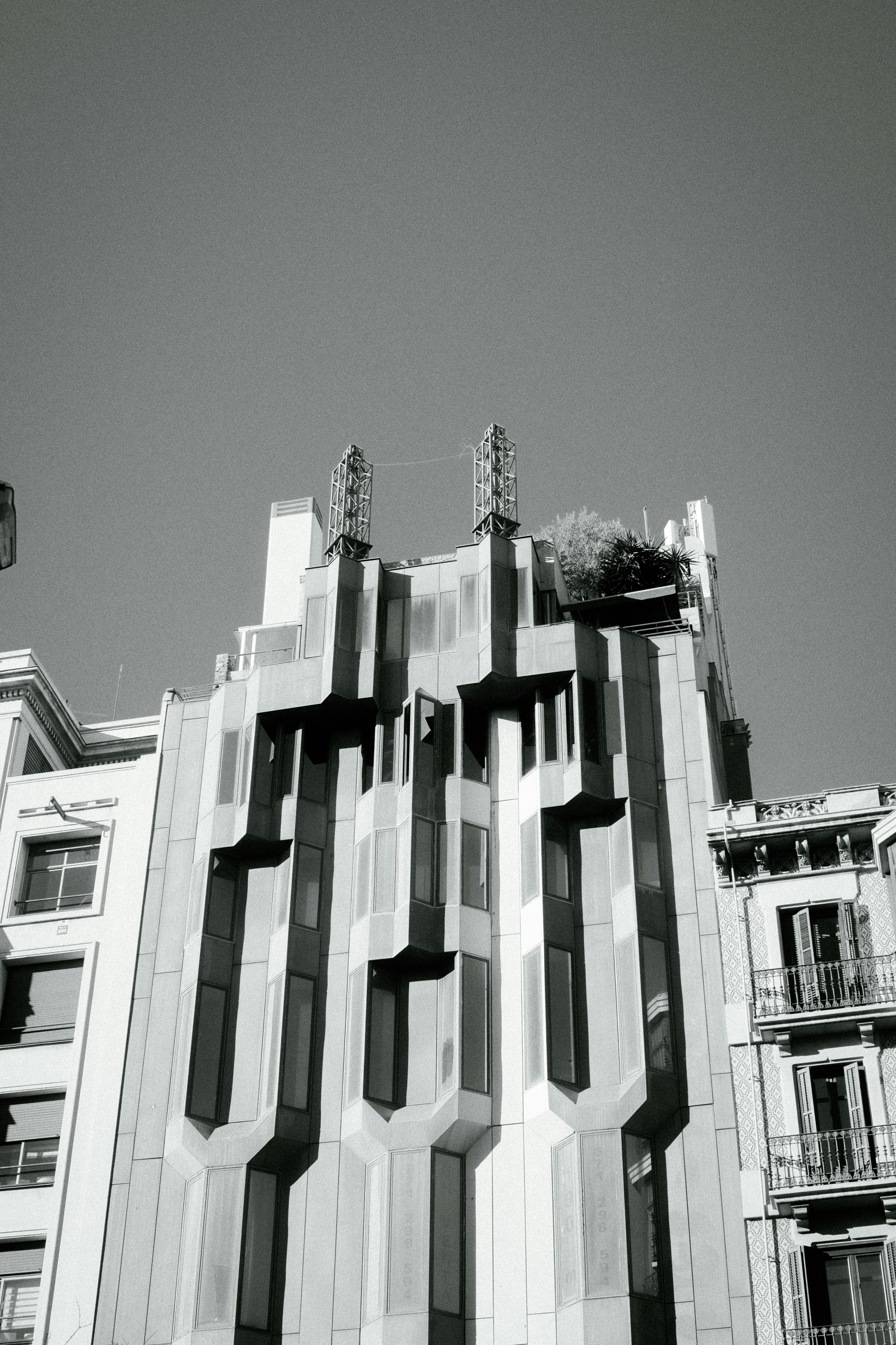 Vertical Prisms: The Monochrome Facade Reaching Toward the Sky